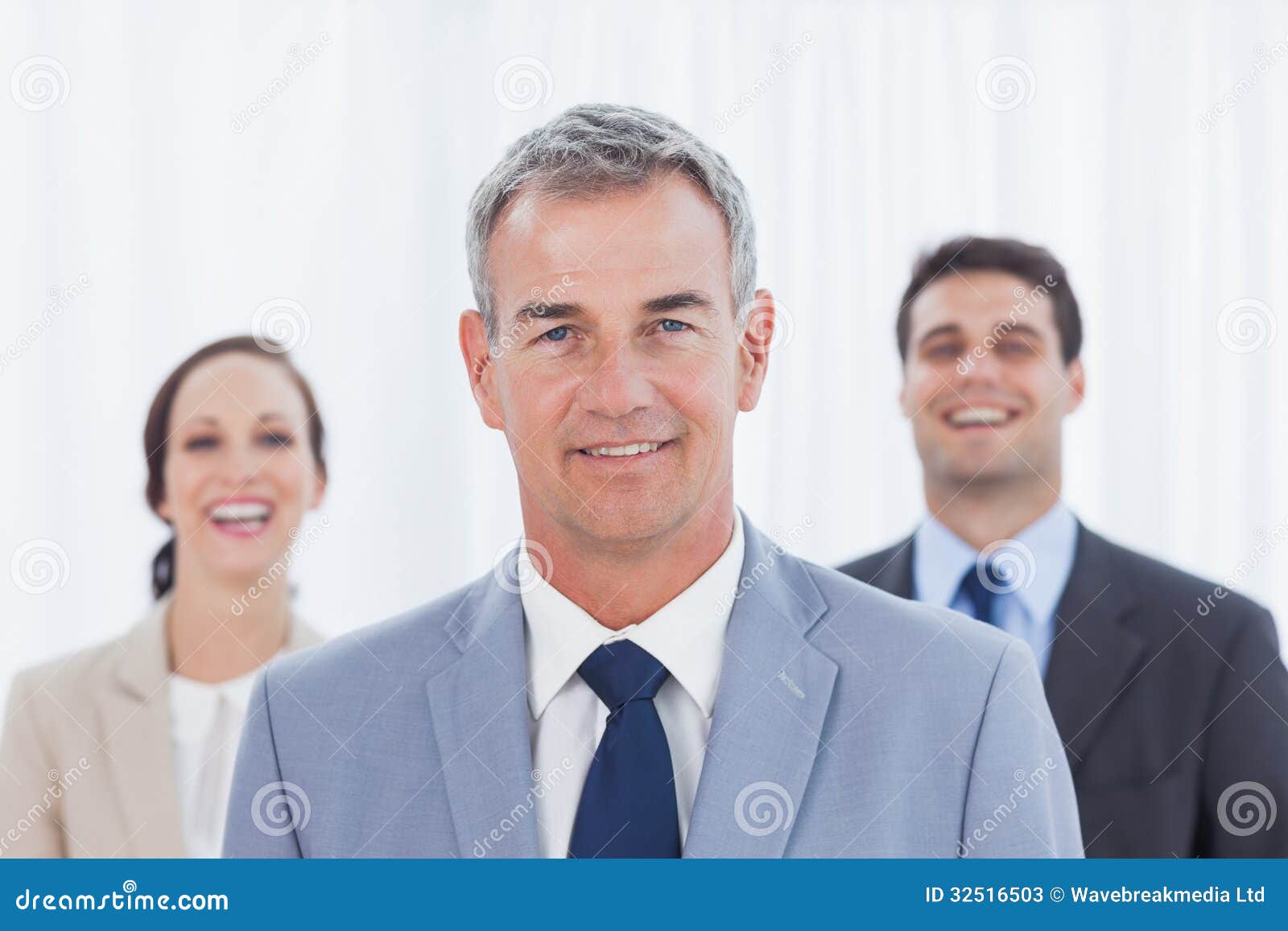 Experienced Businessman Posing with His Work Team Stock Image - Image ...