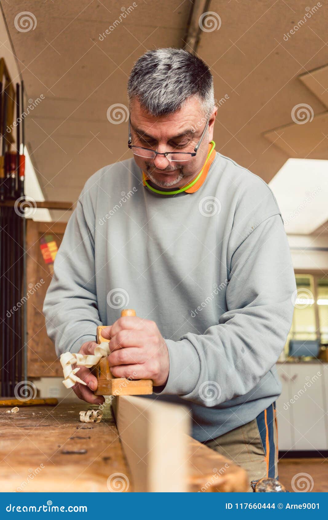 Experienced Carpenter Planing a Board Stock Photo - Image of craftsman ...