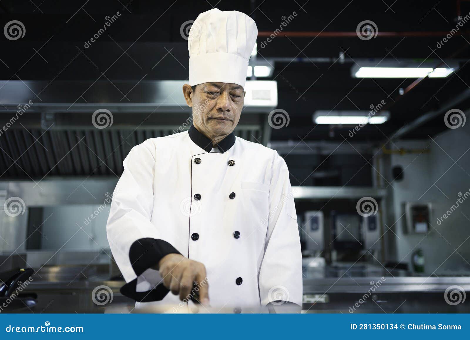 Experienced Chef is Cooking in a Large Kitchen Stock Photo - Image of ...