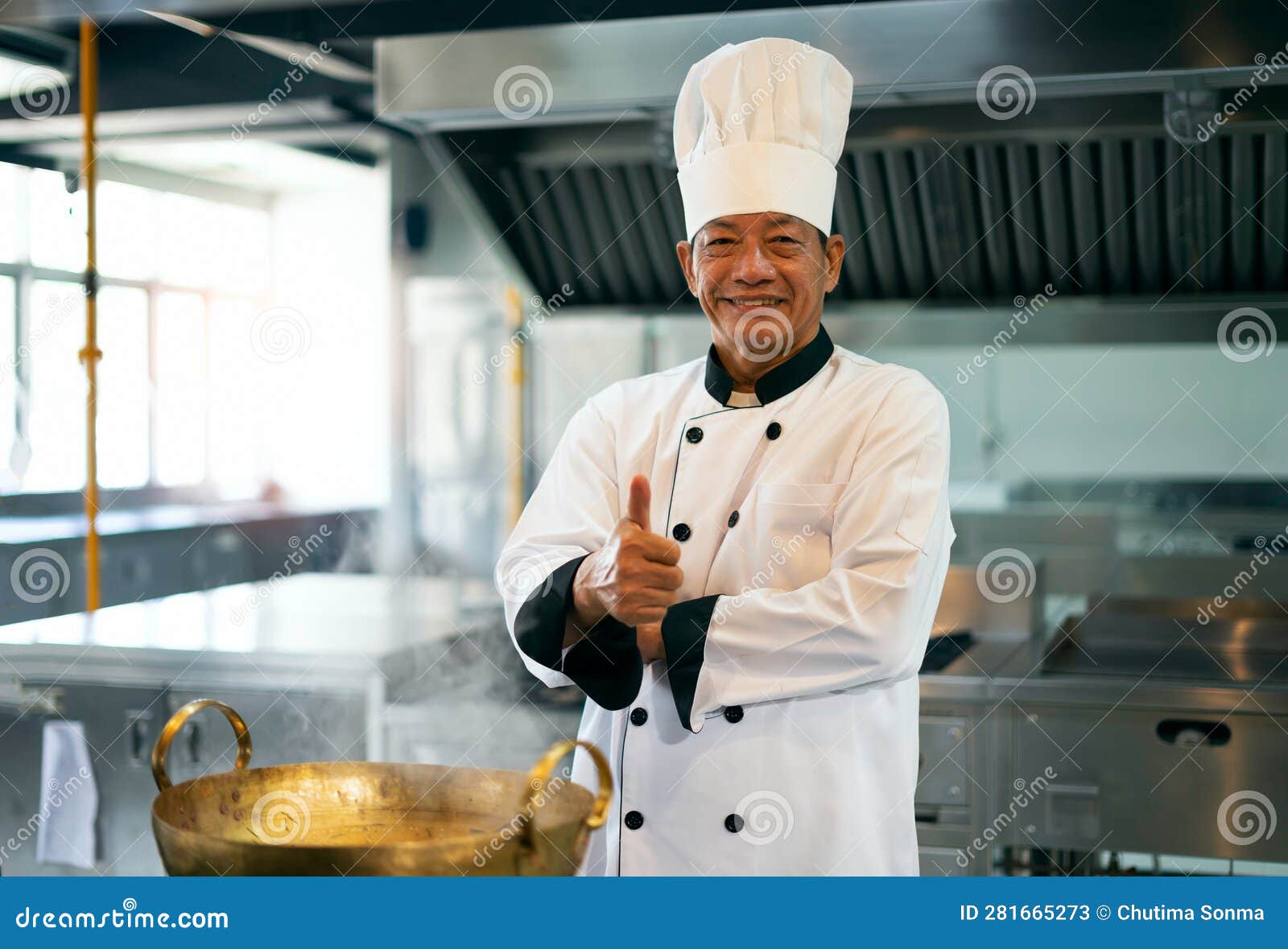 Experienced Chef is Cooking in a Large Kitchen Stock Image - Image of ...