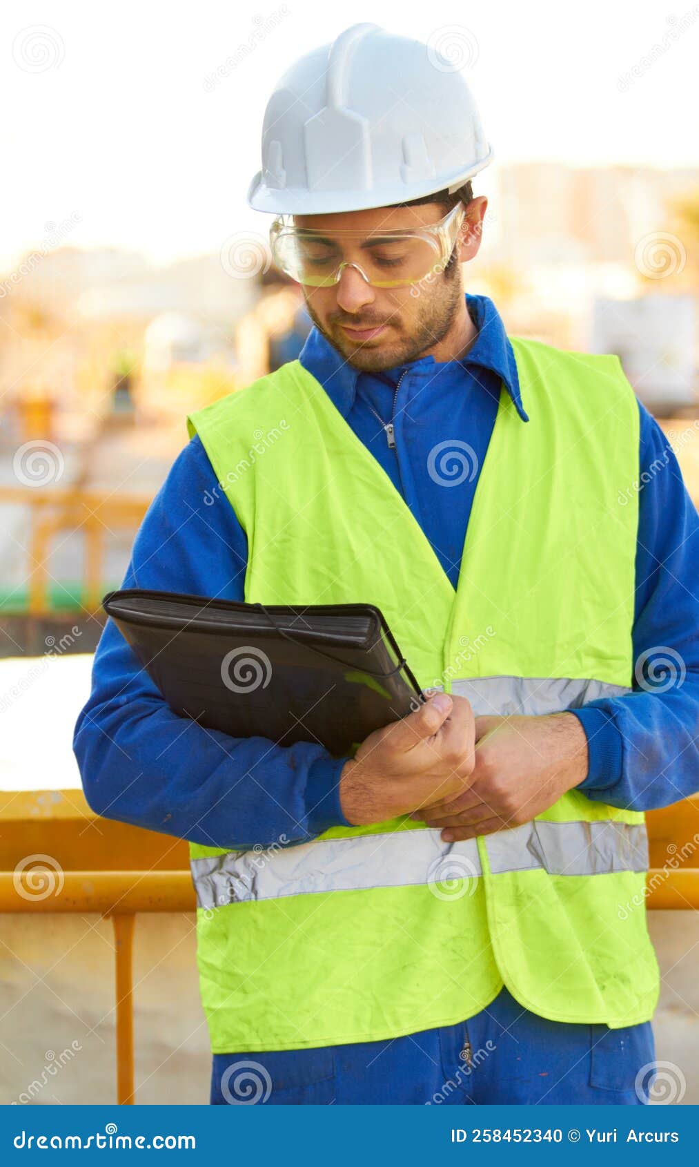 Experienced Contractor. an Engineer Overseeing the Construction of His ...