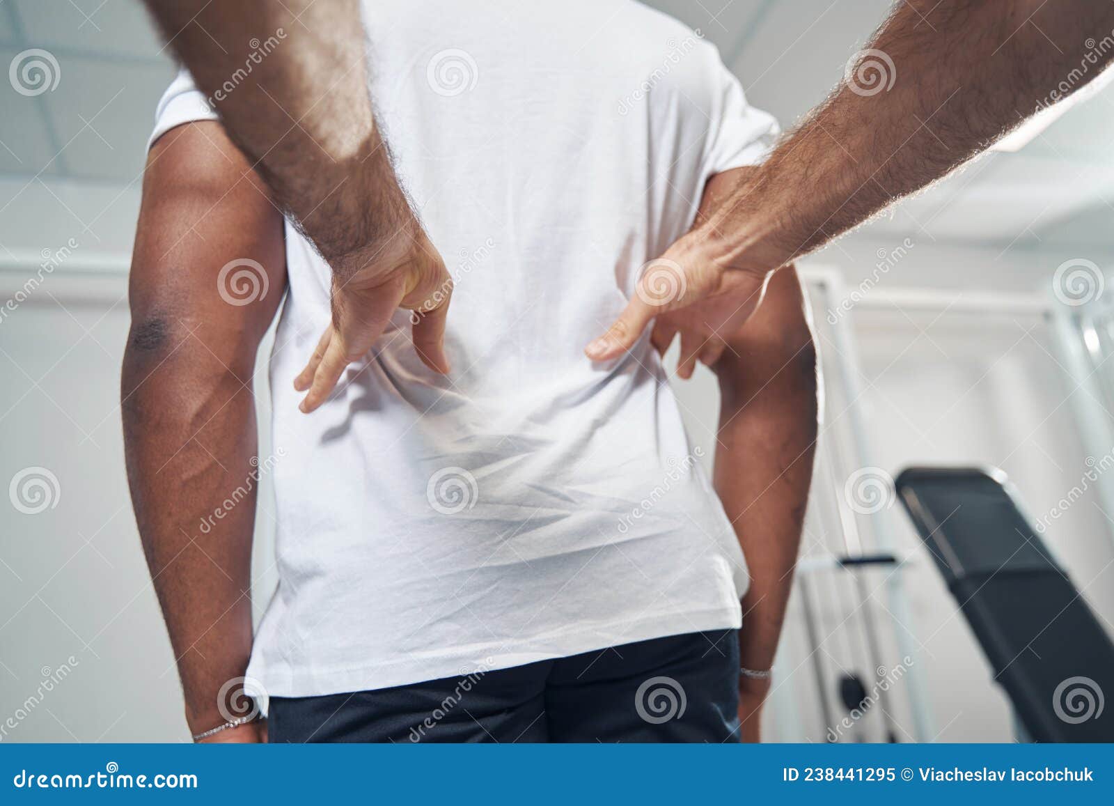 Experienced Doctor Palpating Paralumbar Muscles of Man Stock Image ...