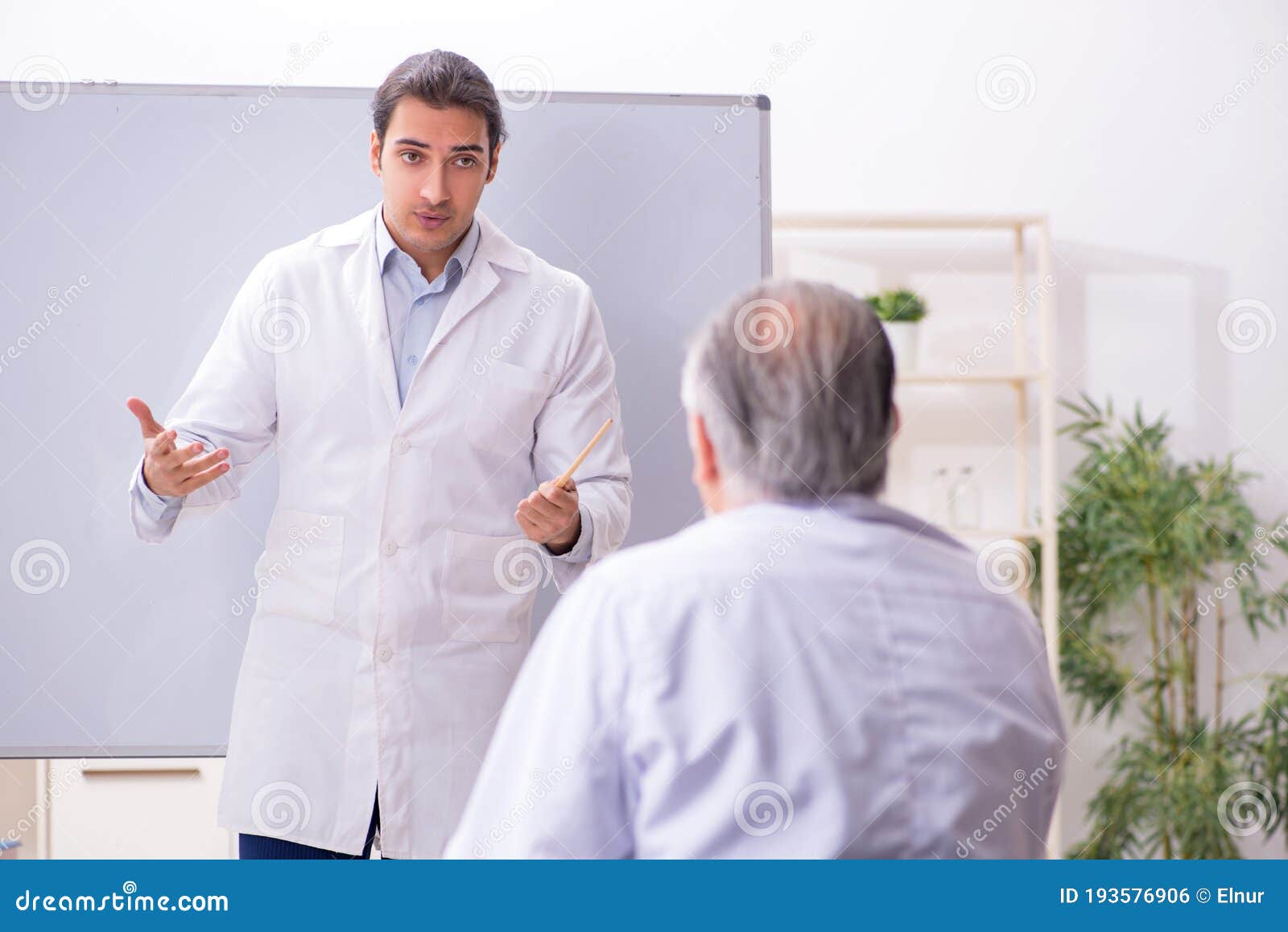 Doctor Teaching Anatomy Using Human Skeleton Model Stock Photo ...