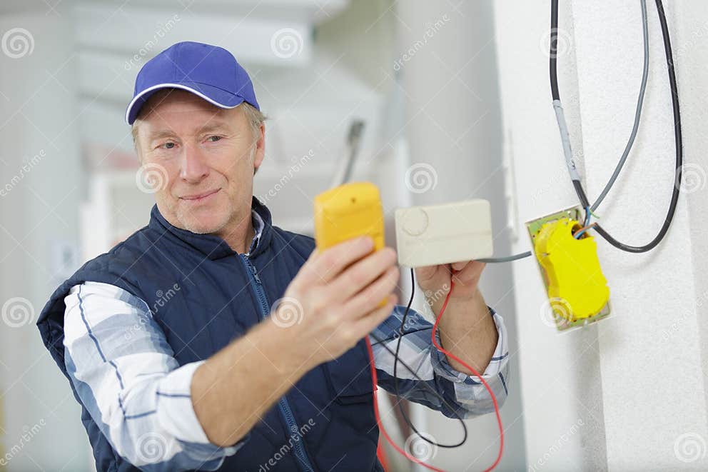 Experienced Electrician Doing Electrical Work with High Precision and ...