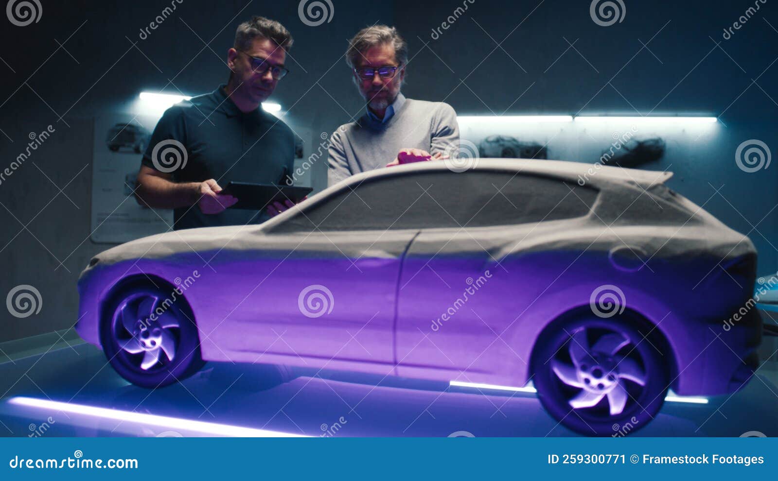 Experienced Engineers Work on Car Model Using Light Shade To Make ...