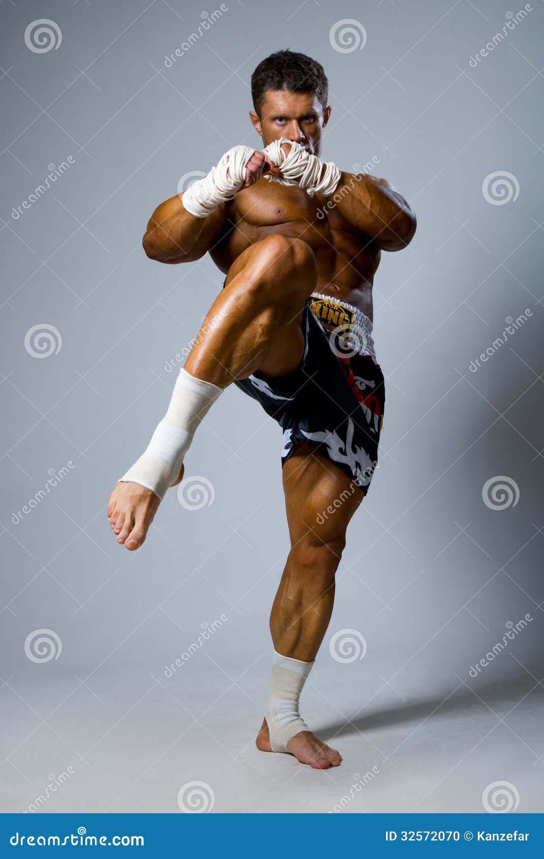 An Experienced Fighter Kickboxer with a Raised Foot. Full Height Stock ...