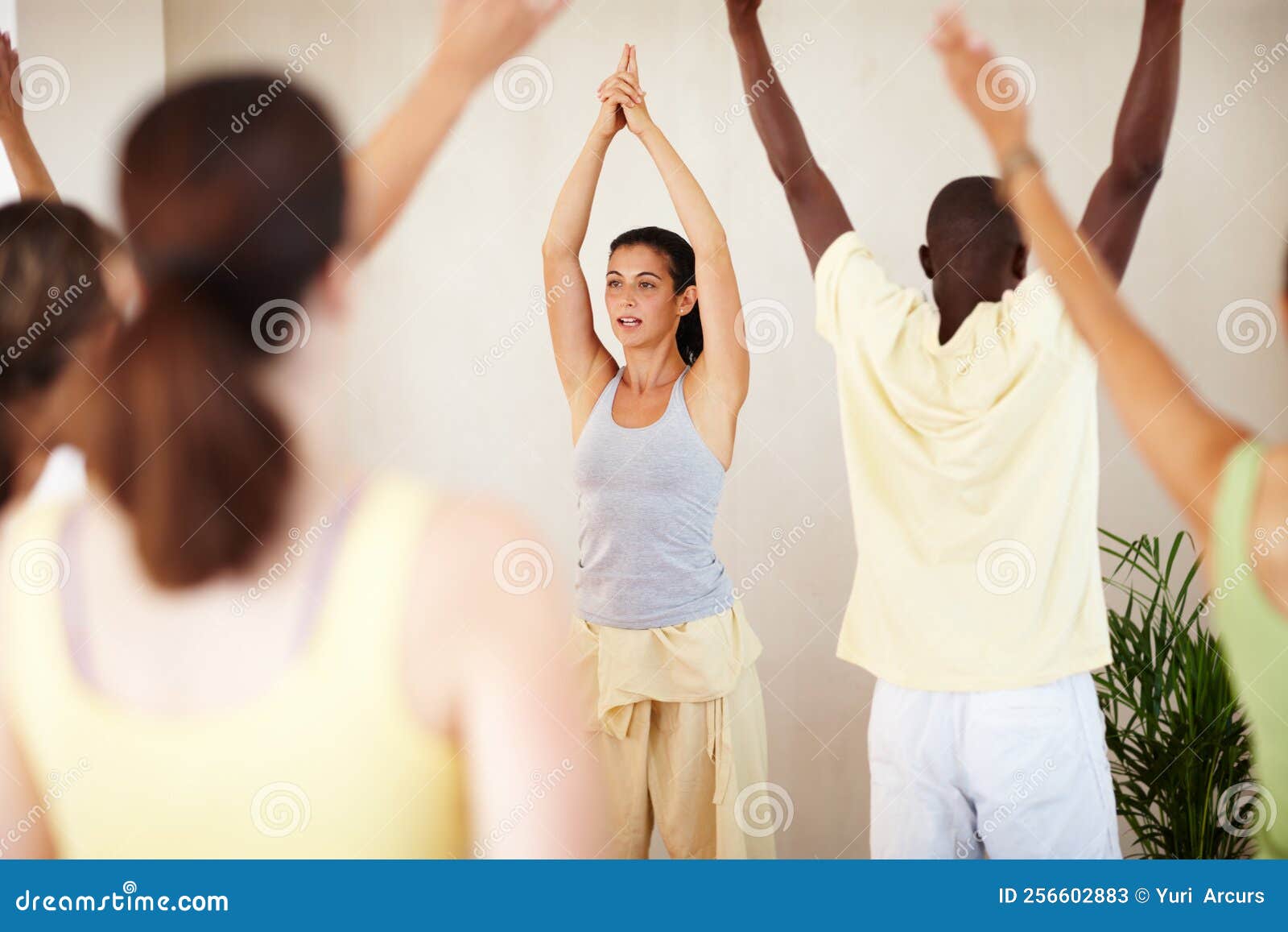 Experienced Instructor Leading Her Class. a Pretty Yoga Instructor ...