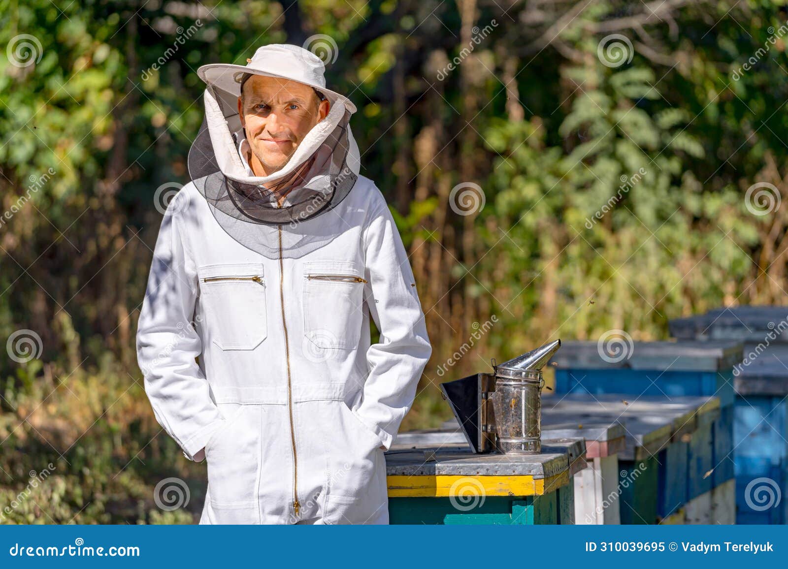 Experienced Male Beekeeper Keeps Hands in Pockets and Poses To the ...