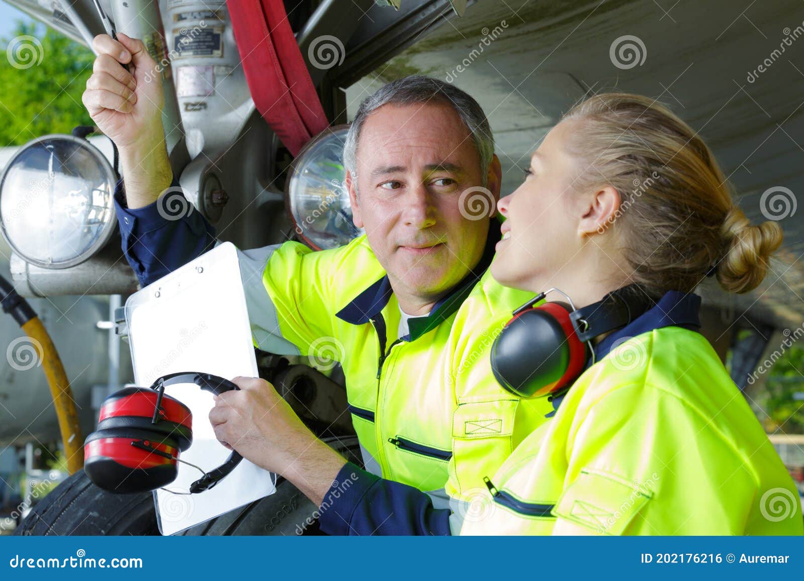 Experienced Male Manager Guiding Female Worker Stock Photo - Image of ...
