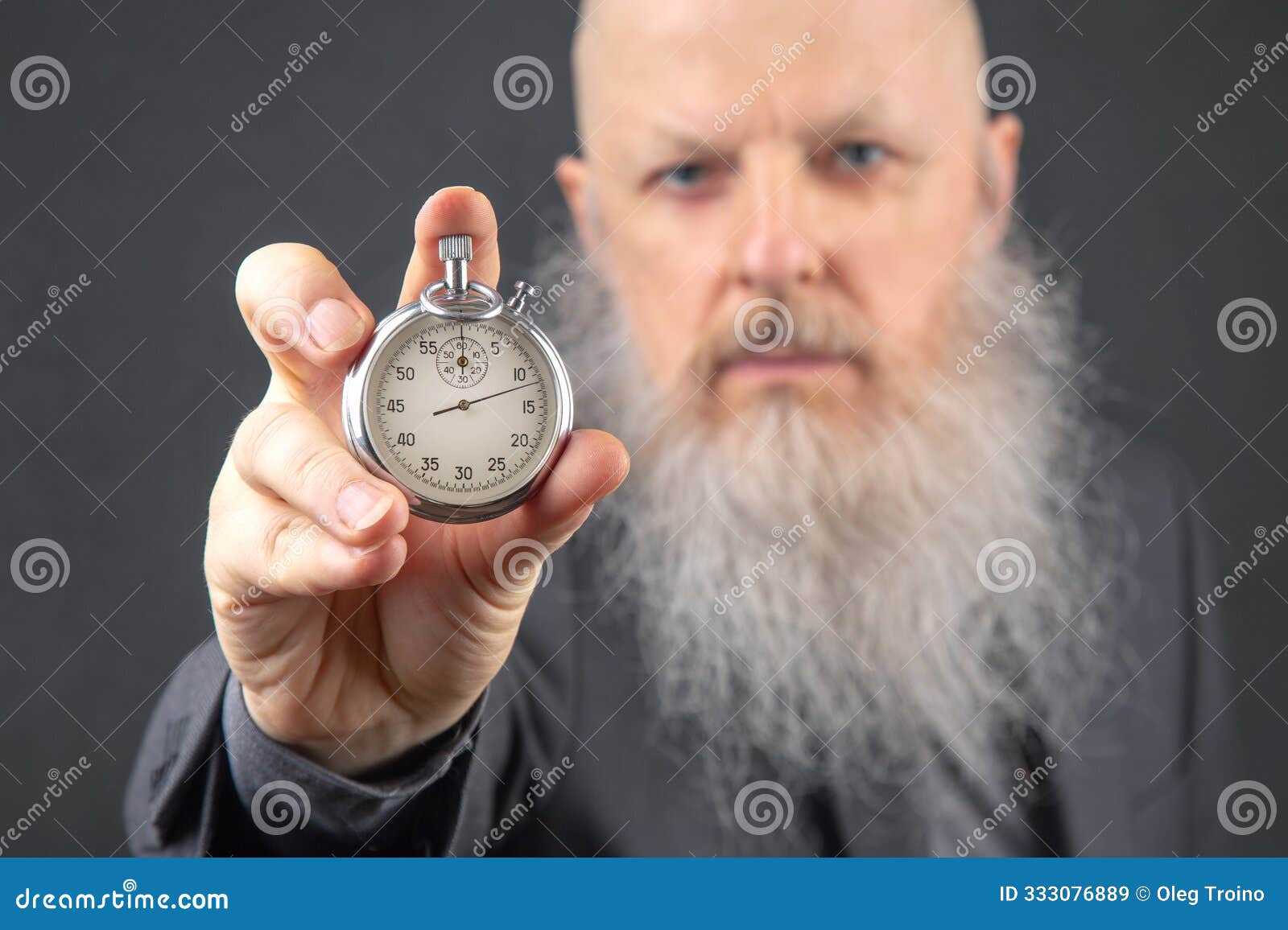 Experienced Man with a Substantial Gray Beard Demonstrating the Time on ...