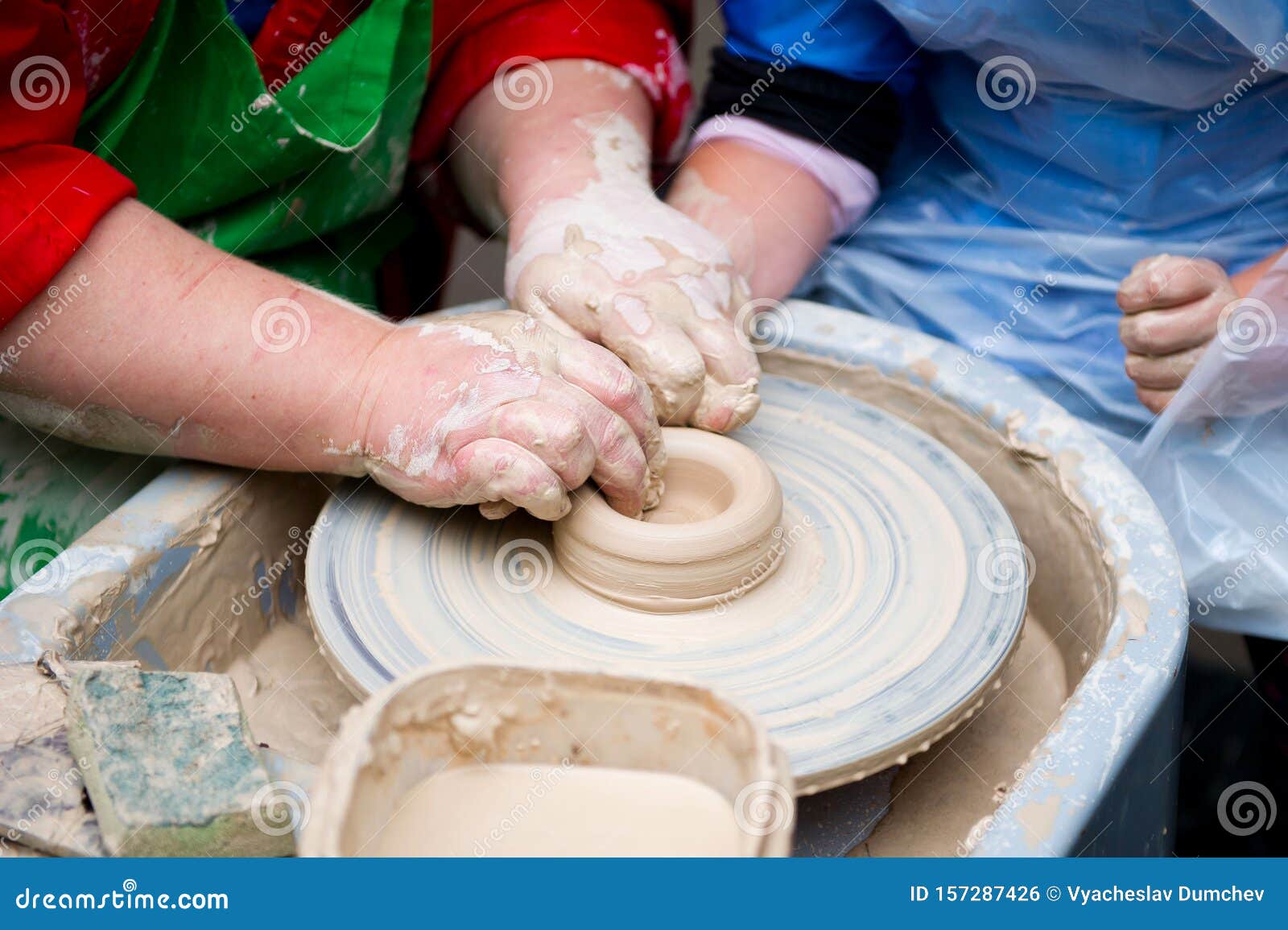 Master in the Production of Jugs Teaches a Student Stock Photo - Image ...