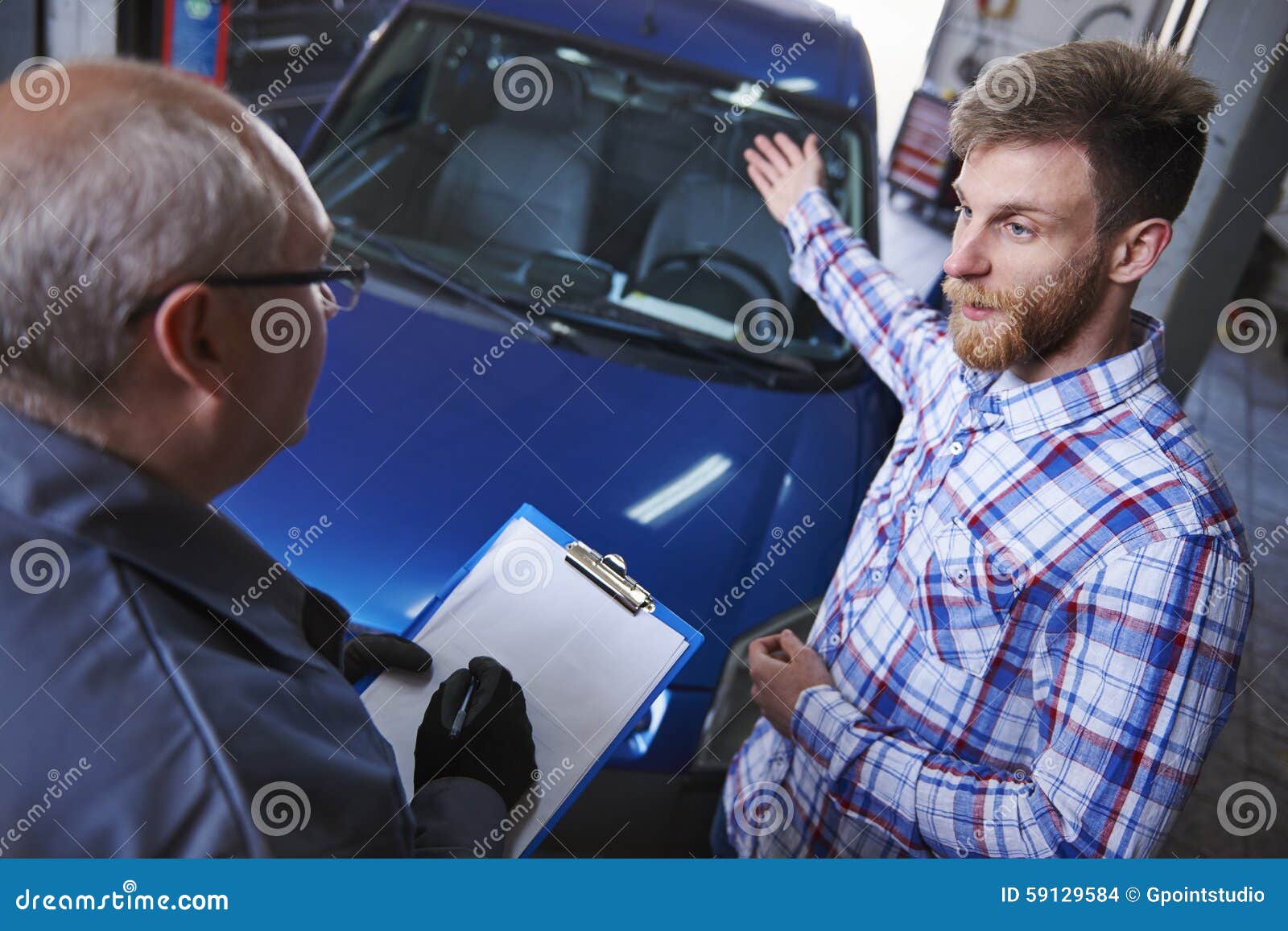 Experienced Mechanic with Client Stock Photo - Image of gesturing ...