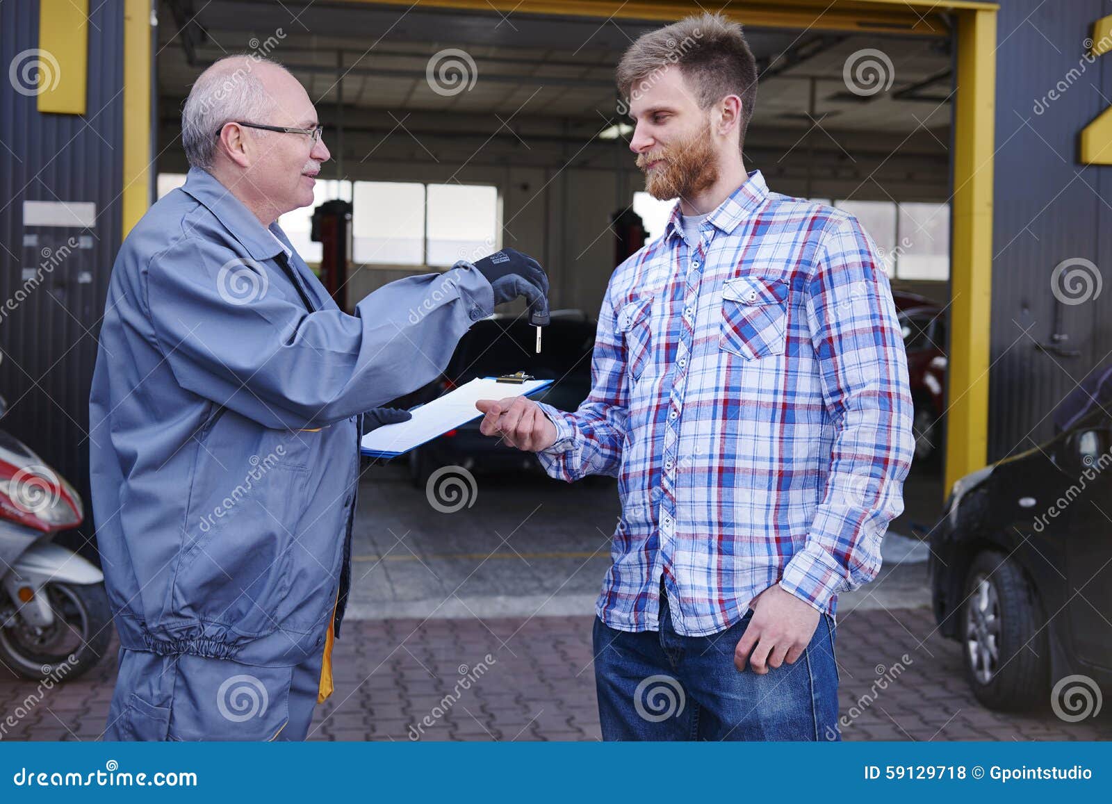 Experienced Mechanic with Client Stock Photo - Image of holding ...