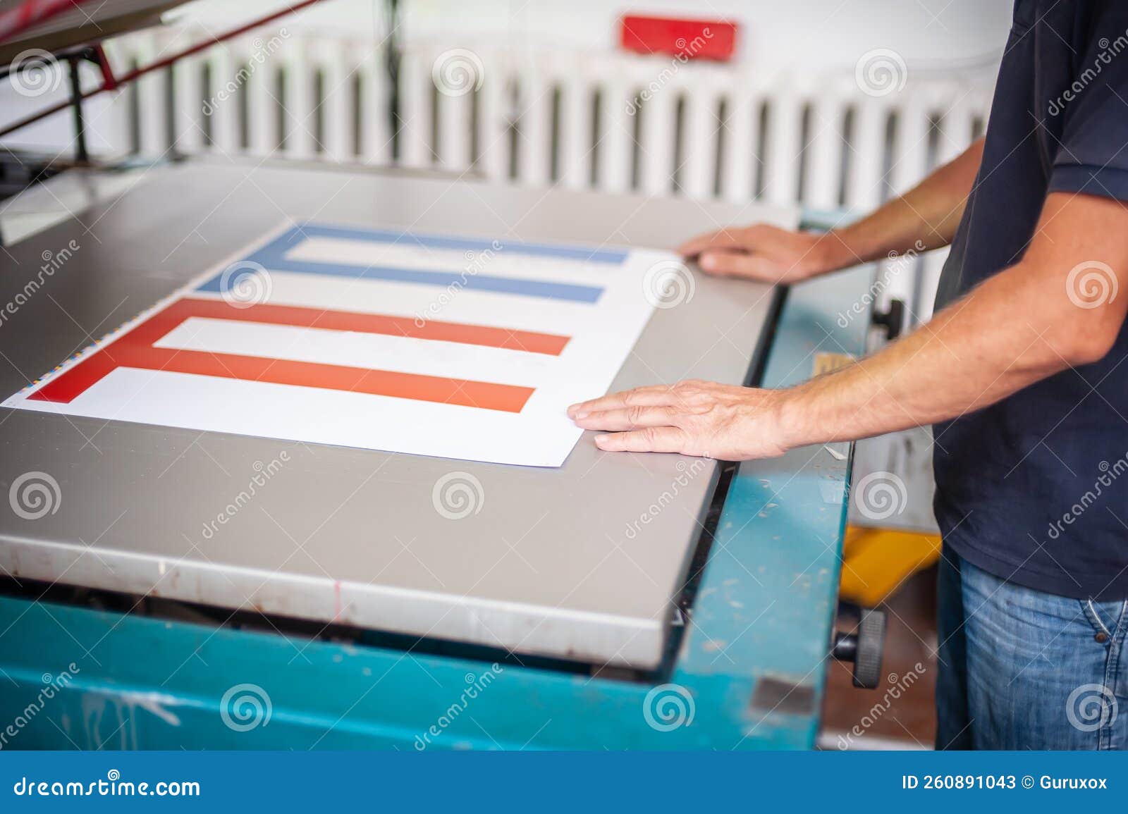 An Experienced Operator Works on a Screen Printing Machine Stock Image ...