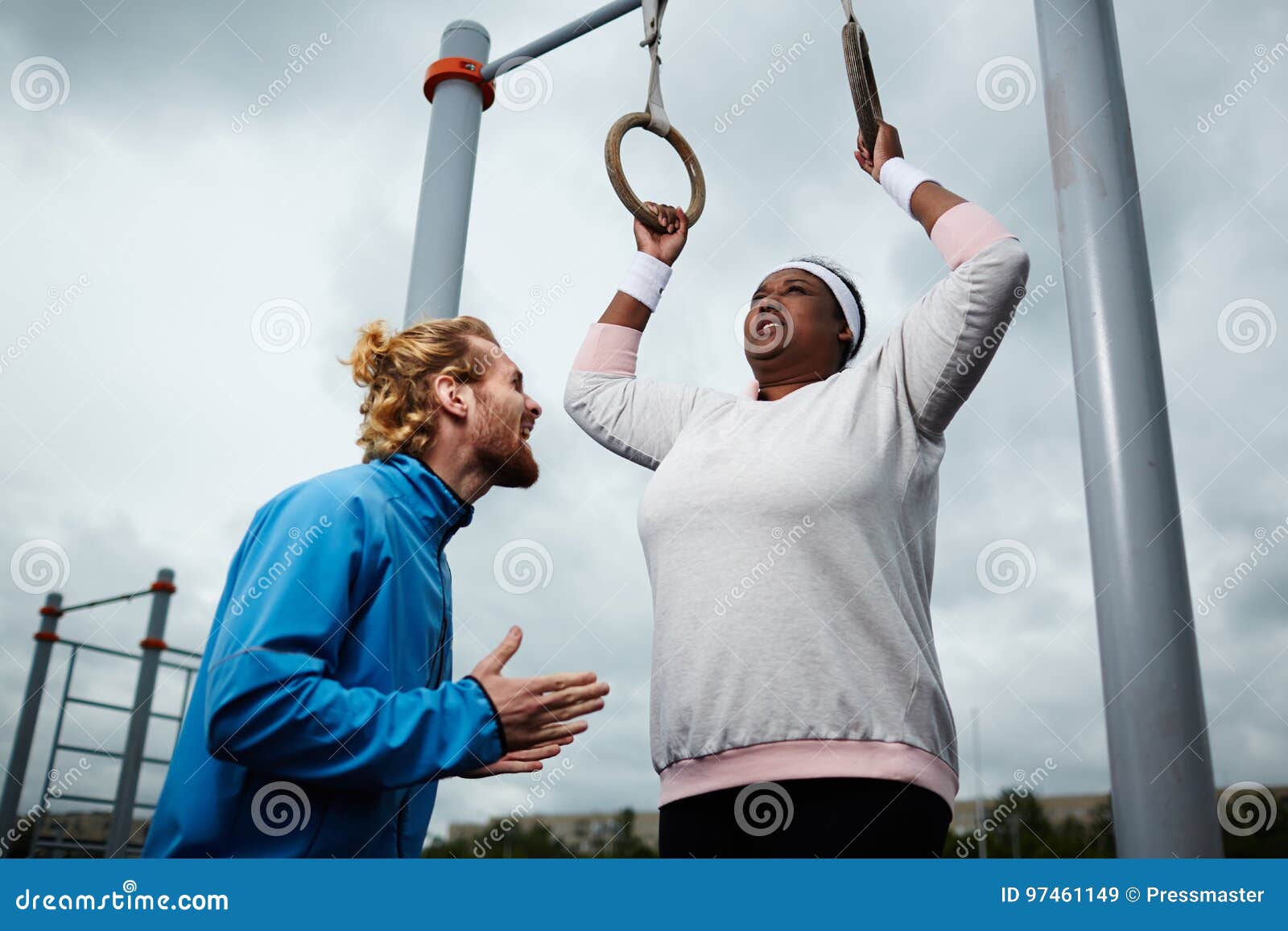 Experienced Personal Trainer Motivating Plus-size Female To Exercise ...