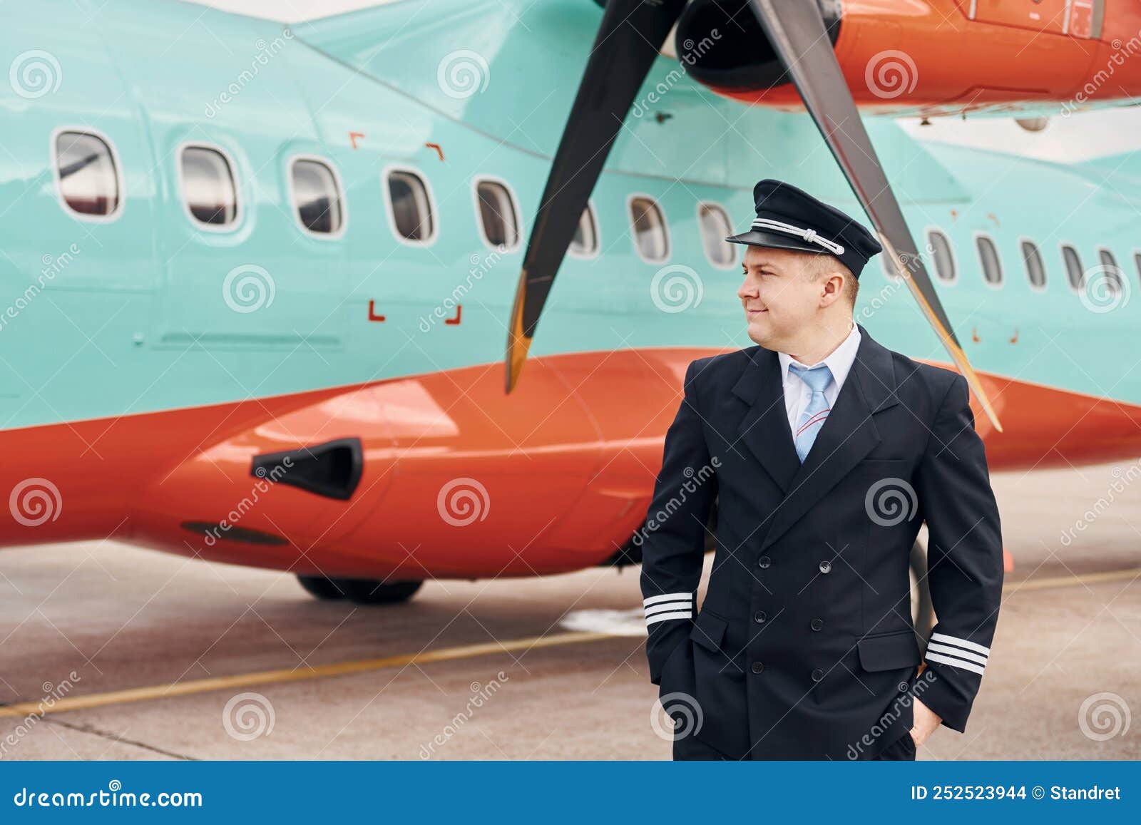 Experienced Pilot in Uniform Standing Outside Near Plane Stock Photo ...