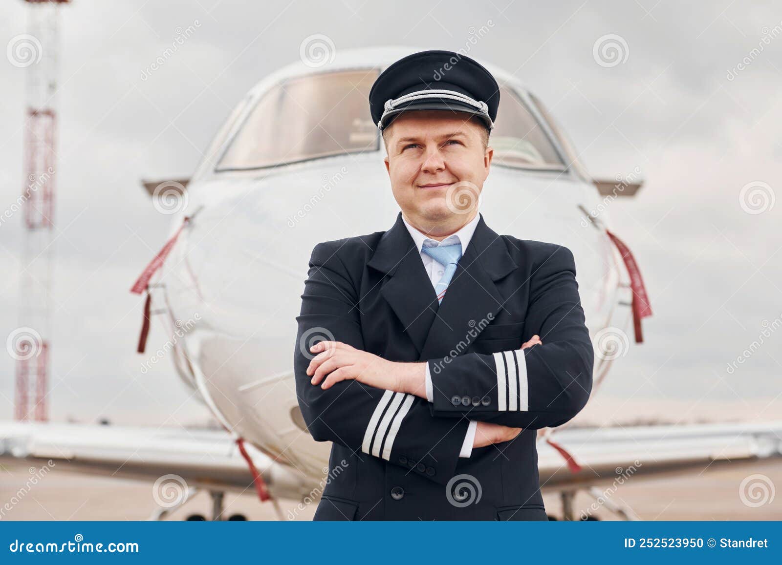 Experienced Pilot in Uniform Standing Outside Near Plane Stock Photo ...