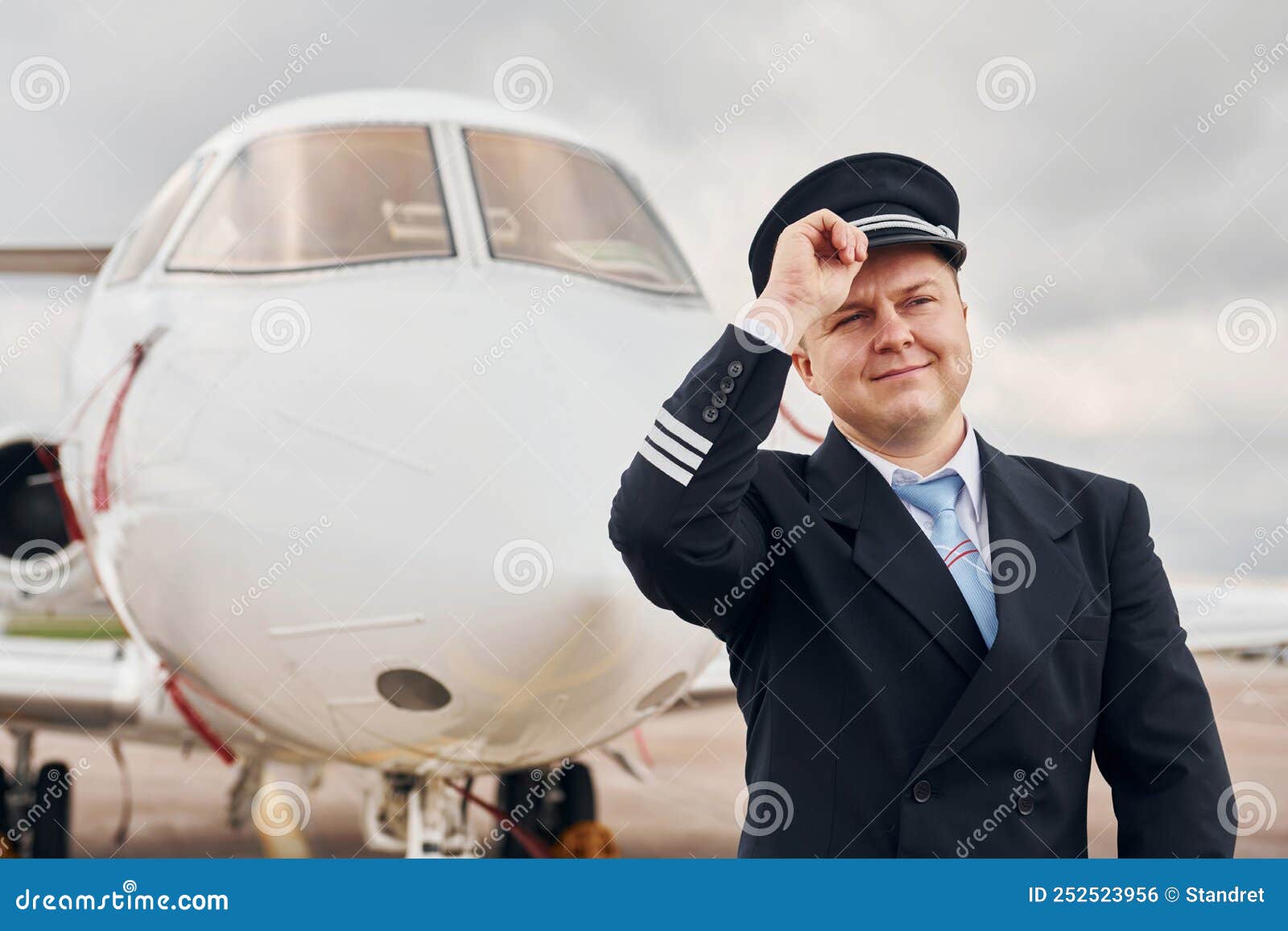 Experienced Pilot in Uniform Standing Outside Near Plane Stock Photo ...