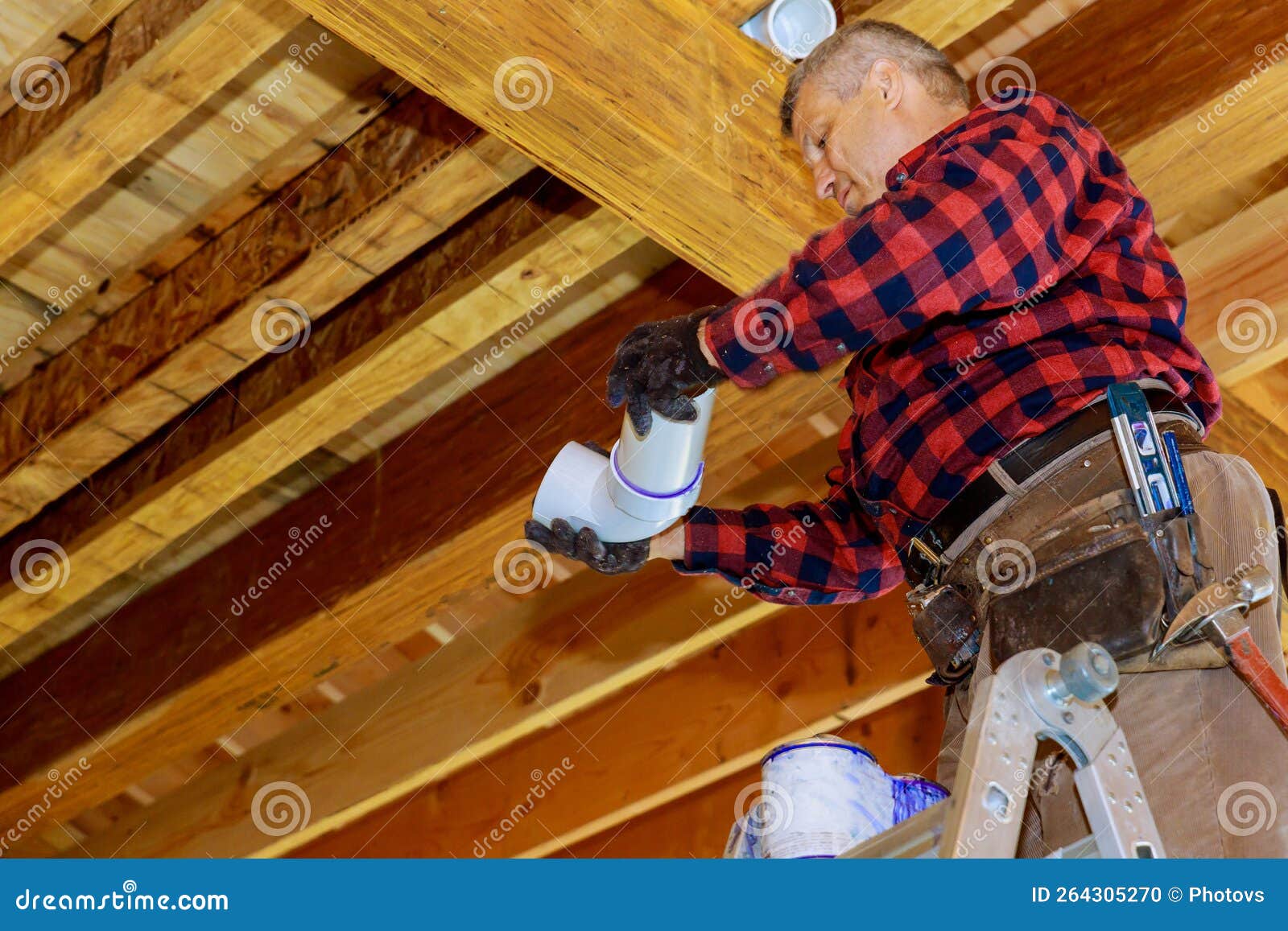 An Experienced Plumber Joins Plastic Pipes by Using Cement Glue on a ...