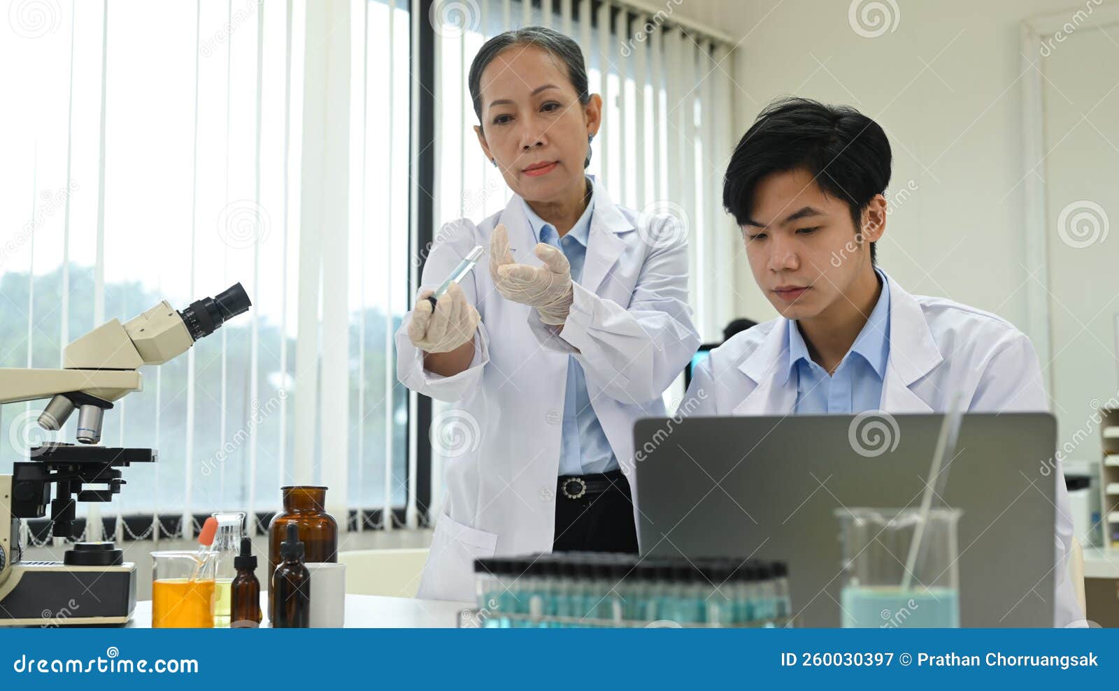 Experienced Scientists Team Conducting Experiments, Consisting of ...