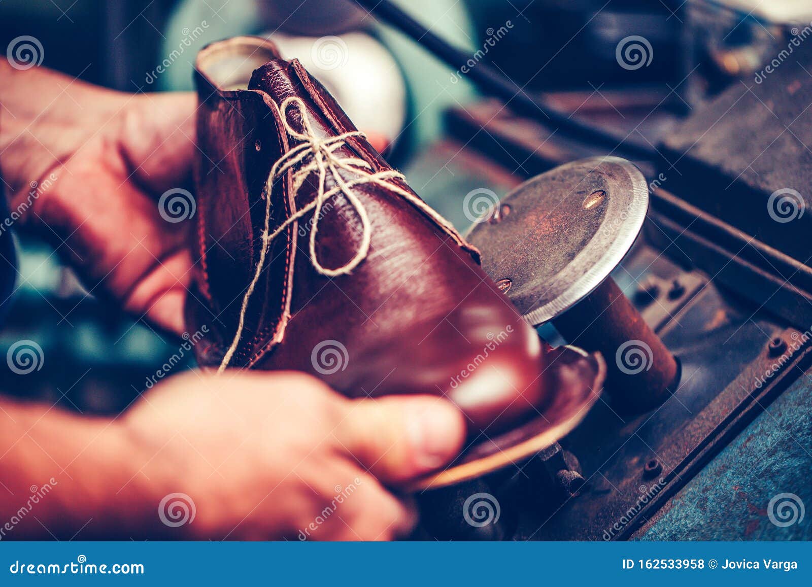 Experienced Shoemaker Using Special Machine Tool for Making a Shoes ...