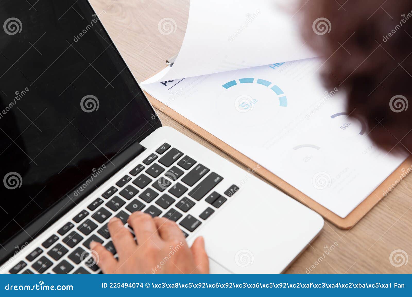 Experienced Staff Members Use the Computer while Viewing Financial ...