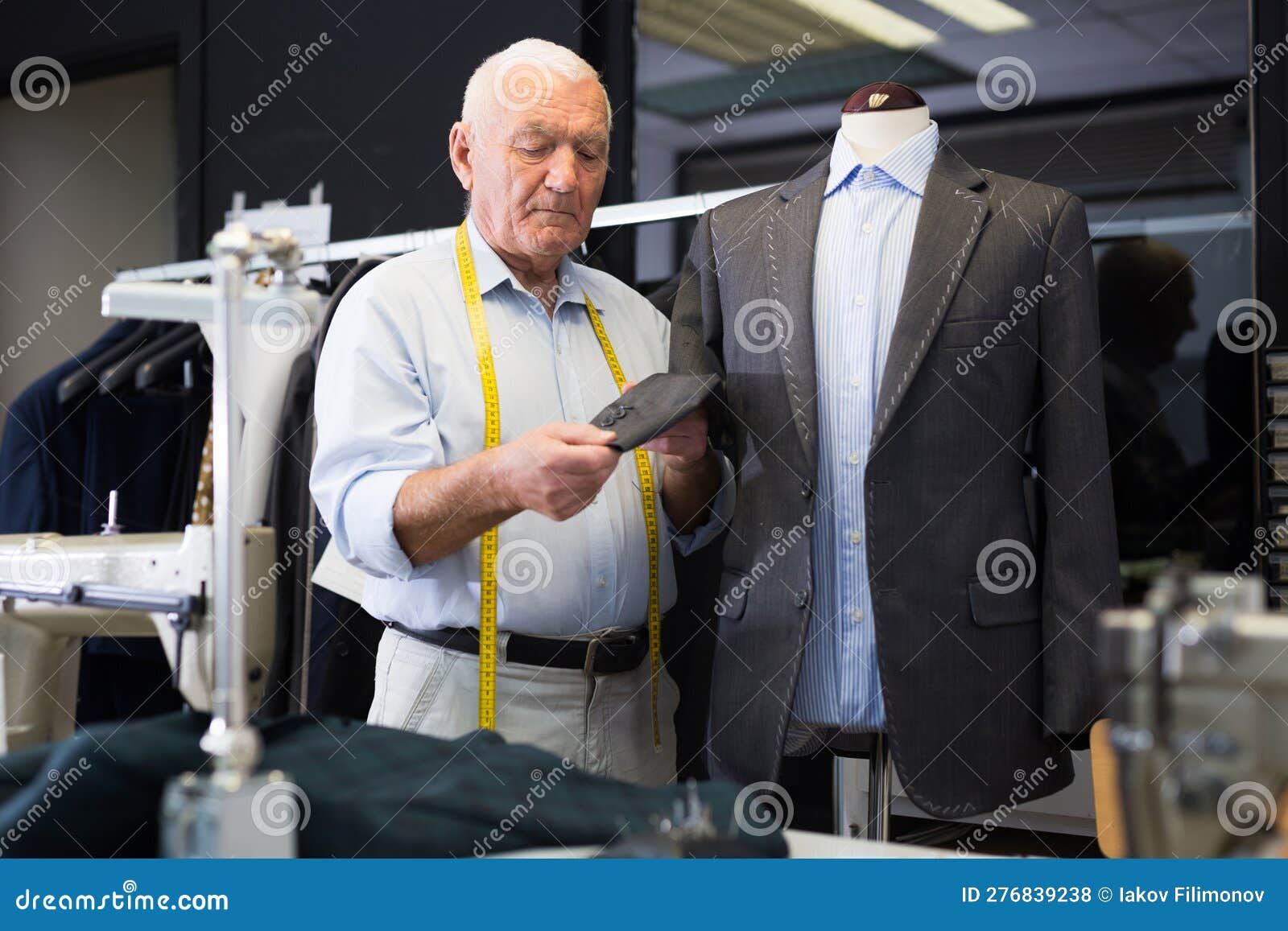 Experienced Tailor Threading Jacket before Starting Work in Workshop ...