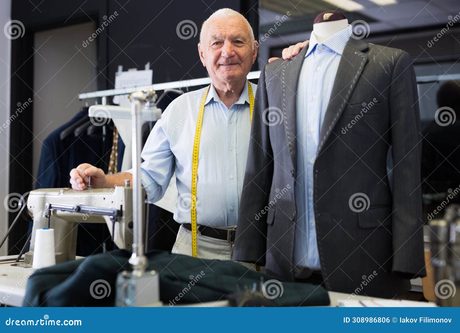 Experienced Tailor Threading Jacket before Starting Work in Workshop ...