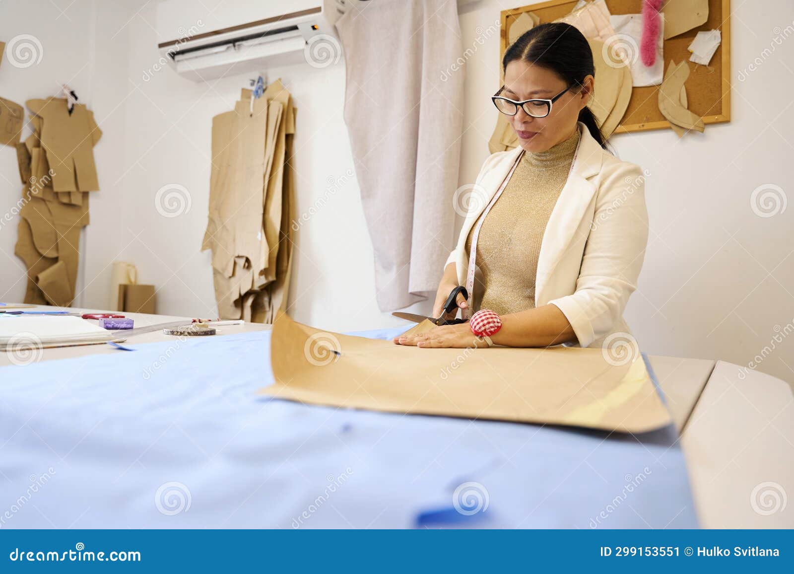 Experienced Tailoring Master Works with Fabric and Patterns Stock Image ...
