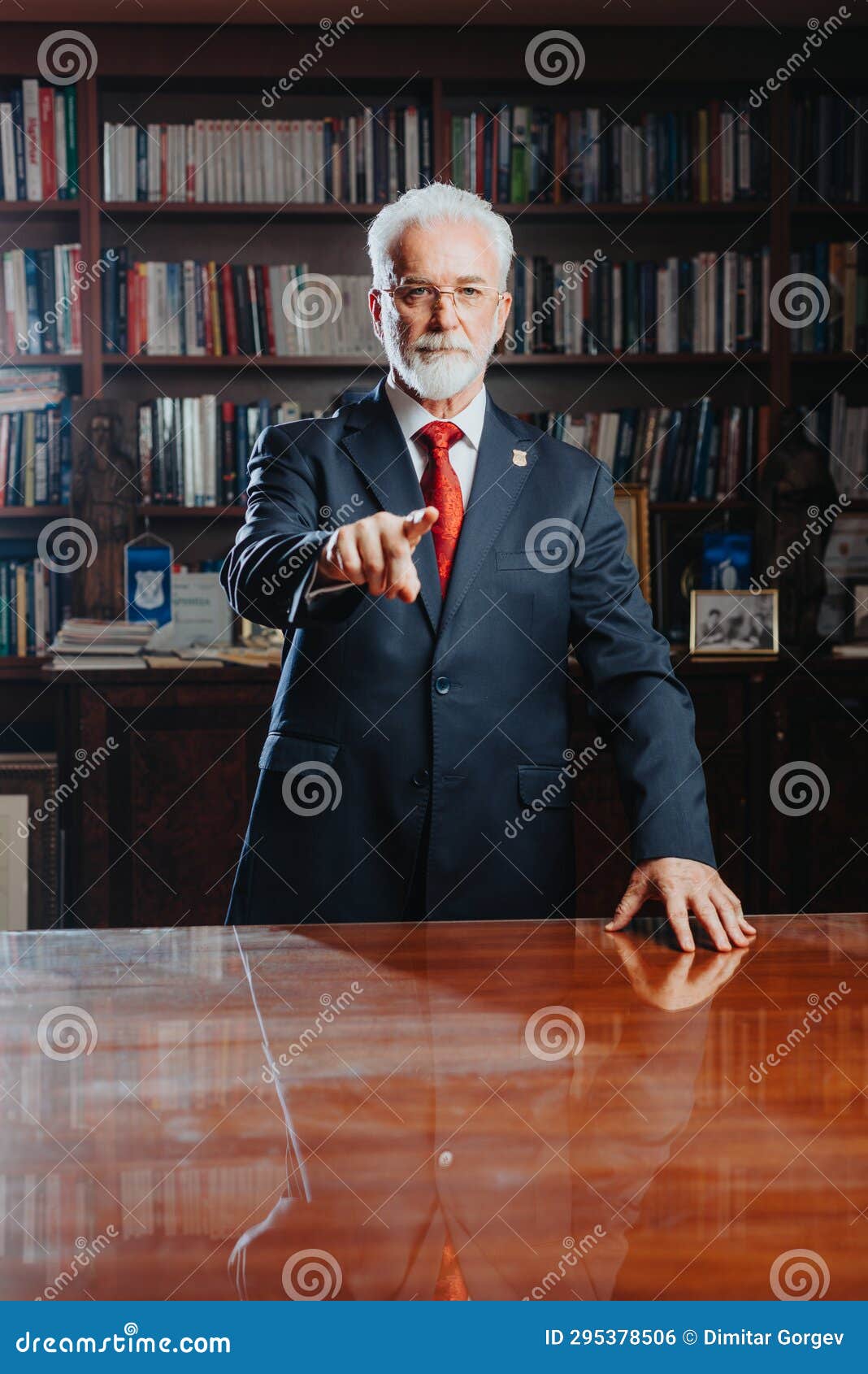 Experienced University Rector Posing Confidently among Bookshelves with ...