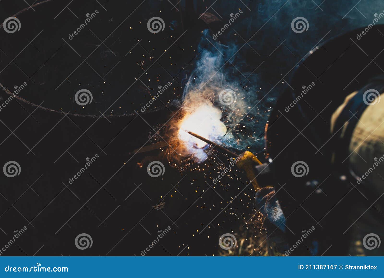 An Experienced Welder at Work. Preparation and Welding Process of Cast ...