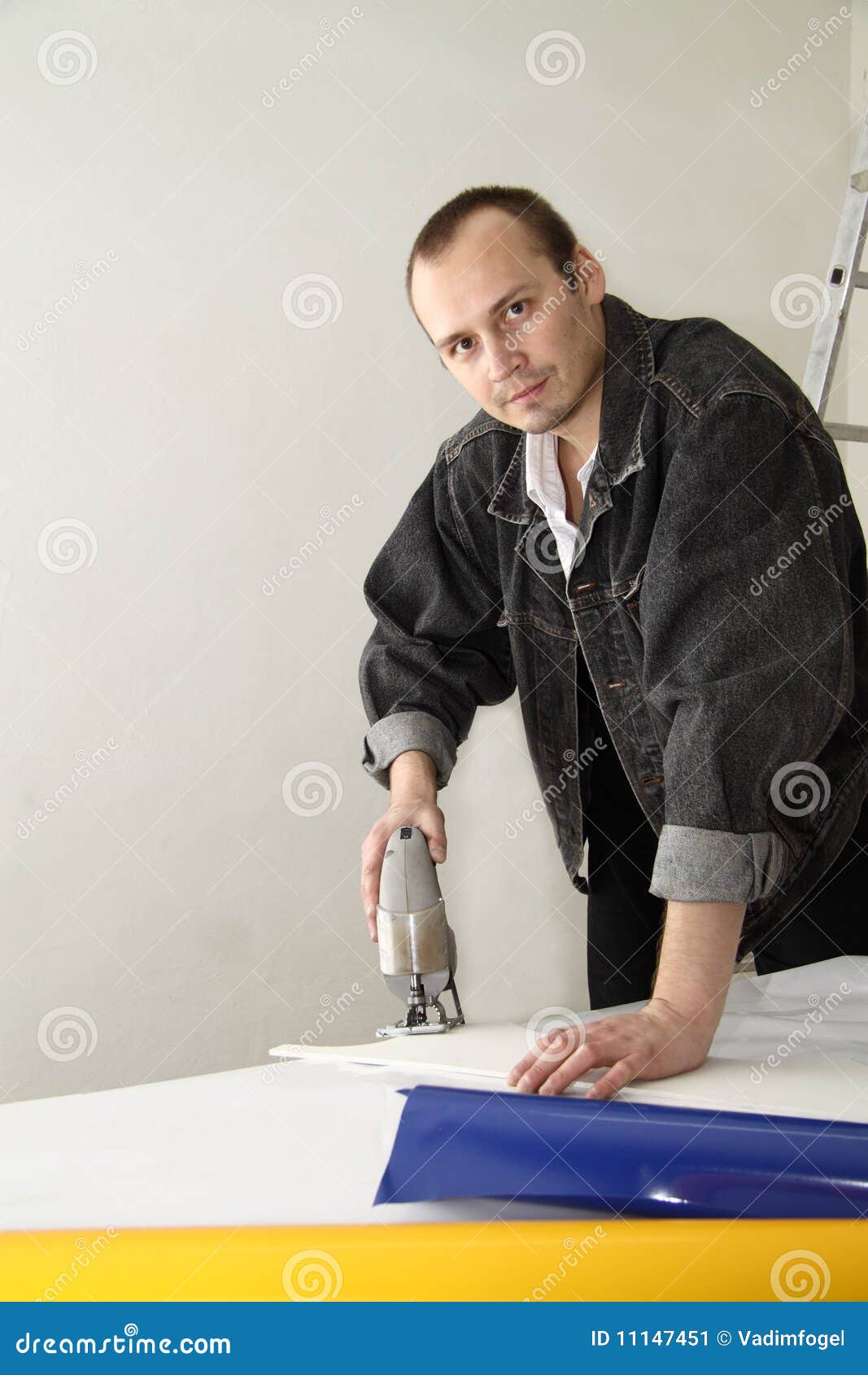 An Experienced Worker Does His Work with Jigsaws Stock Image - Image of ...