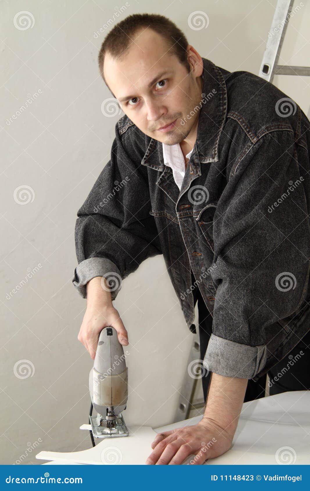 An Experienced Worker Does His Work with Jigsaws Stock Image - Image of ...