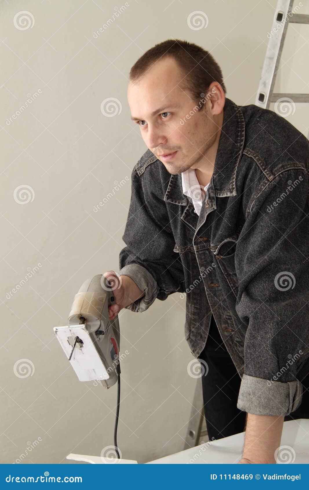 An Experienced Worker Does His Work with Jigsaws Stock Image - Image of ...