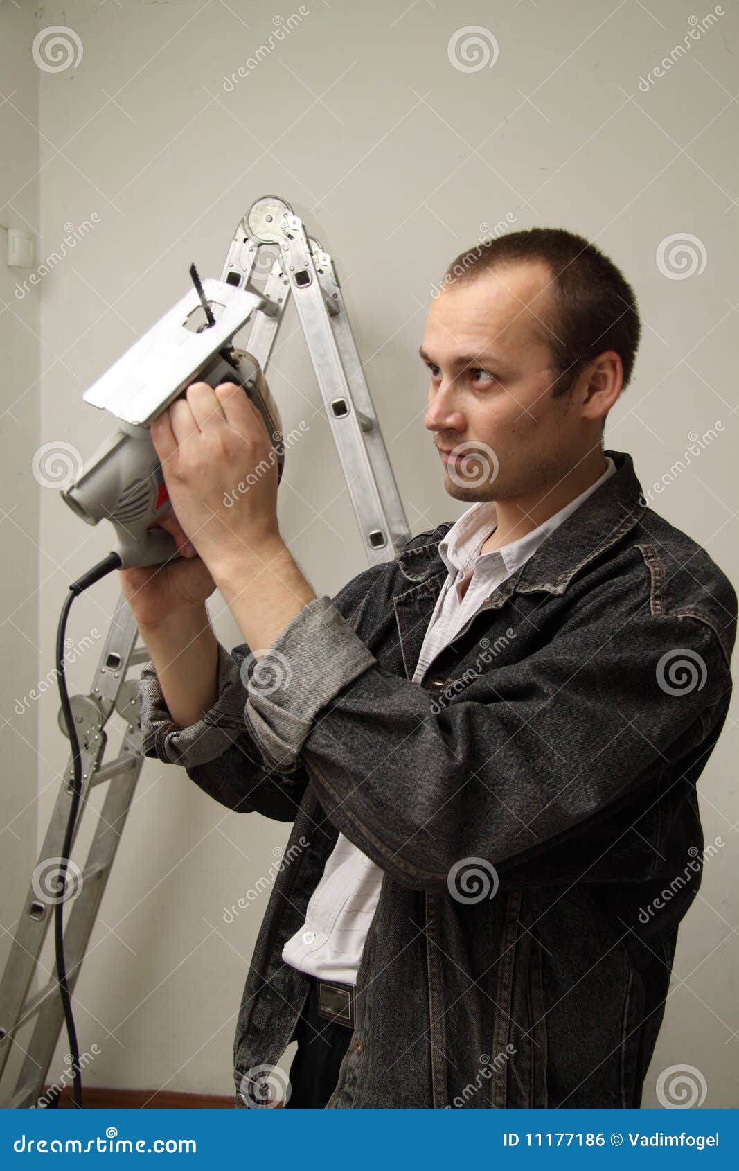 An Experienced Worker Does His Work with Jigsaws Stock Photo - Image of ...