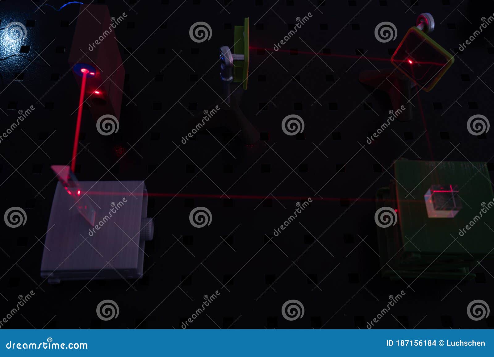 Experiment in Optic Lab with Laser Device. Red Laser on Optical Table ...