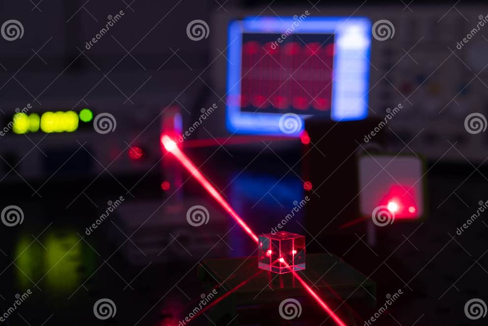 Experiment in Optic Lab with Laser Device. Red Laser on Optical Table ...