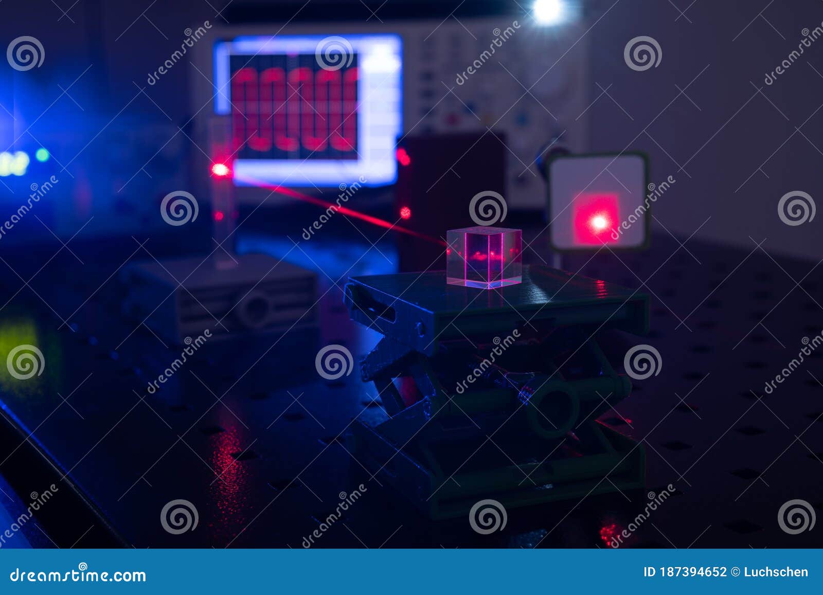Experiment in Optic Lab with Laser Device. Red Laser on Optical Table ...