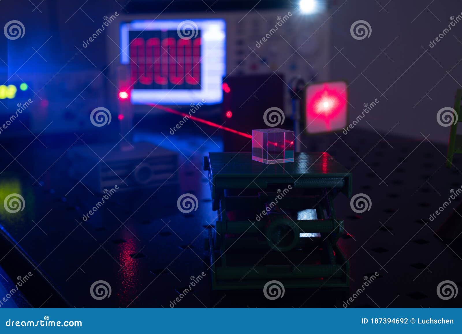 Experiment in Optic Lab with Laser Device. Red Laser on Optical Table ...