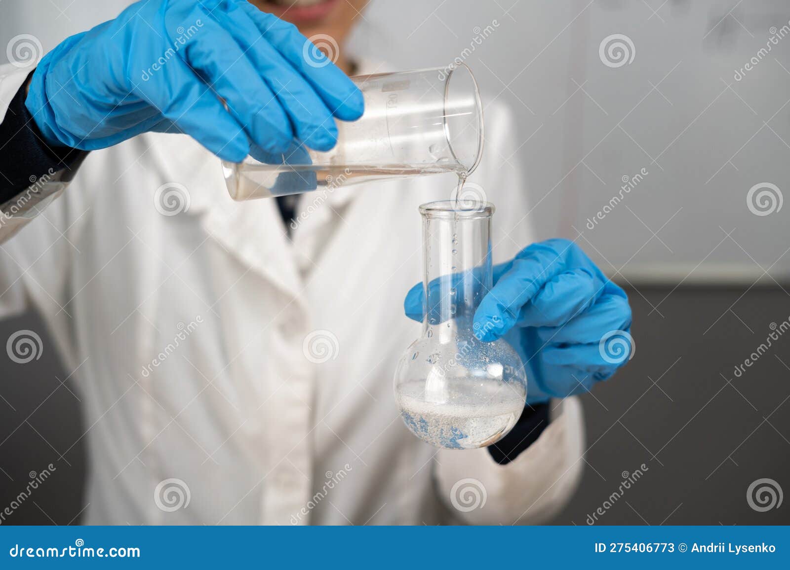 Experiments in a Chemistry Lab, Close-up. Hands and Glass Flasks ...