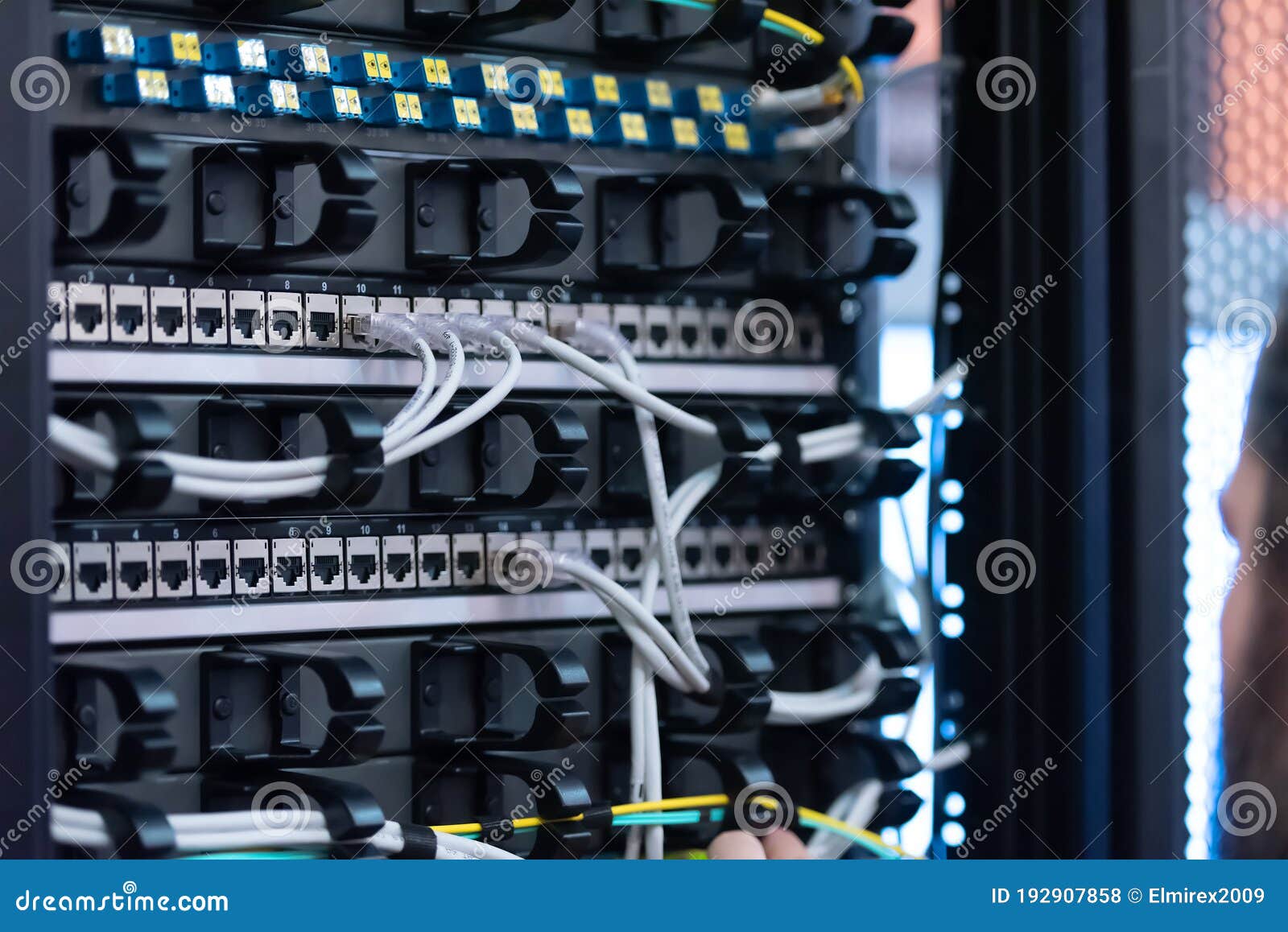An Expert Engeneer In Datacenter Server Room Connecting Cables In ...