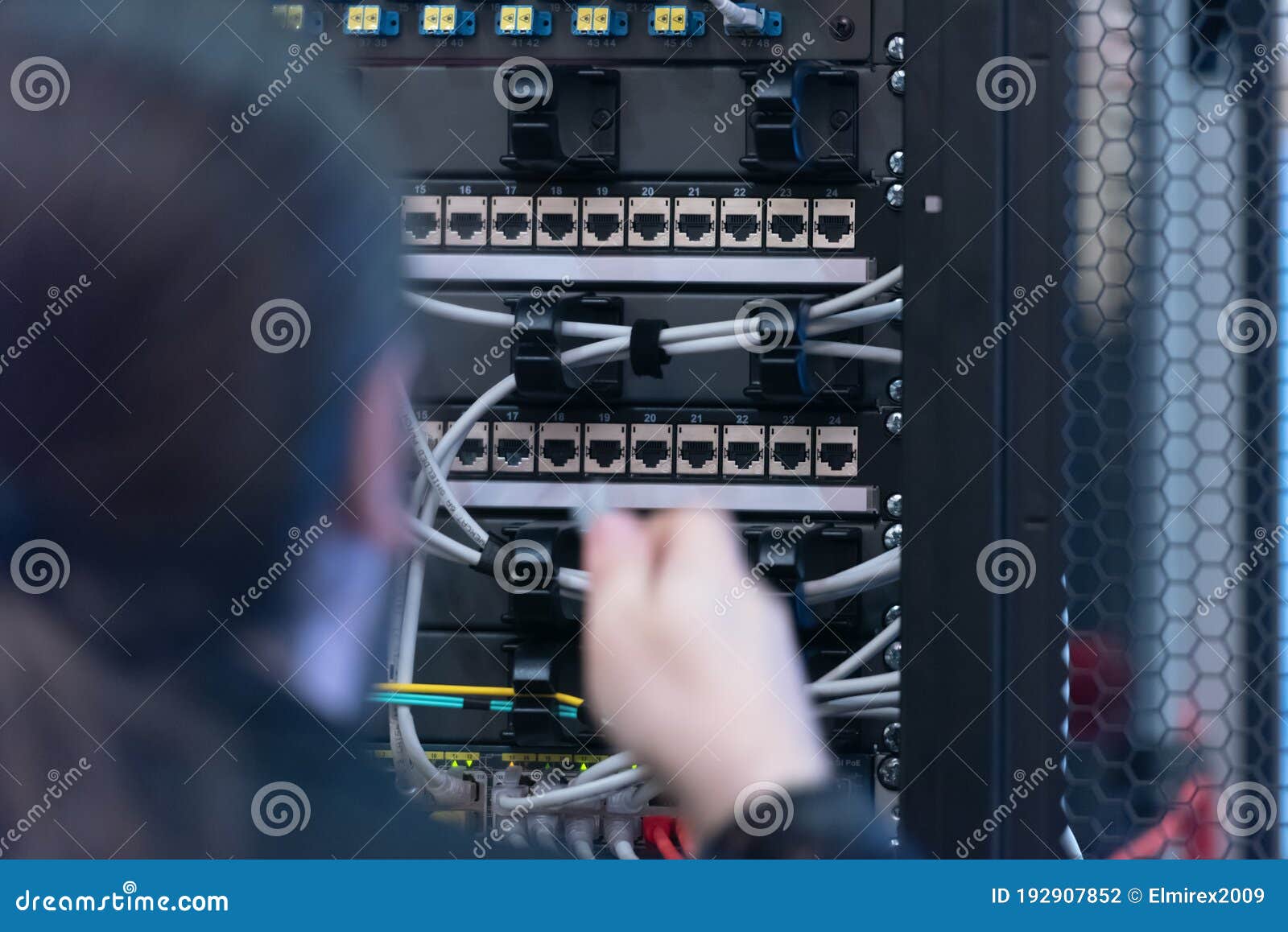 An Expert Engeneer In Datacenter Server Room Connecting Cables In ...
