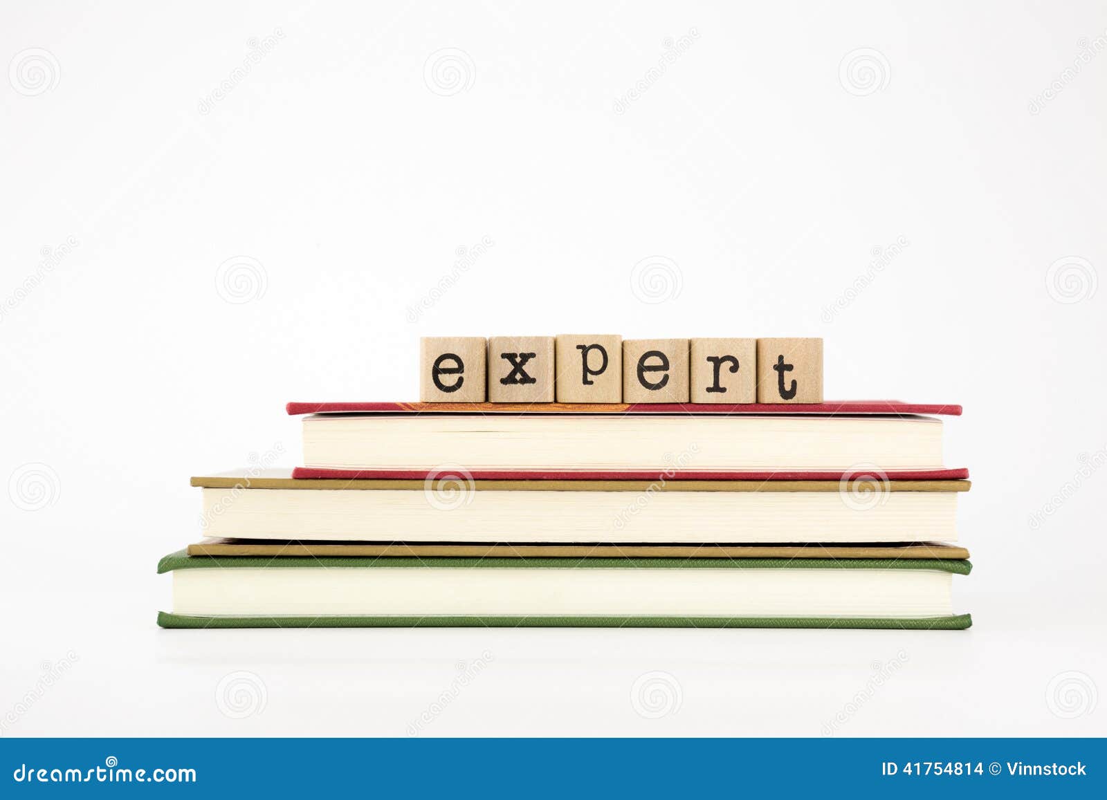 Expert Word on Wood Stamps and Books Stock Photo - Image of text ...
