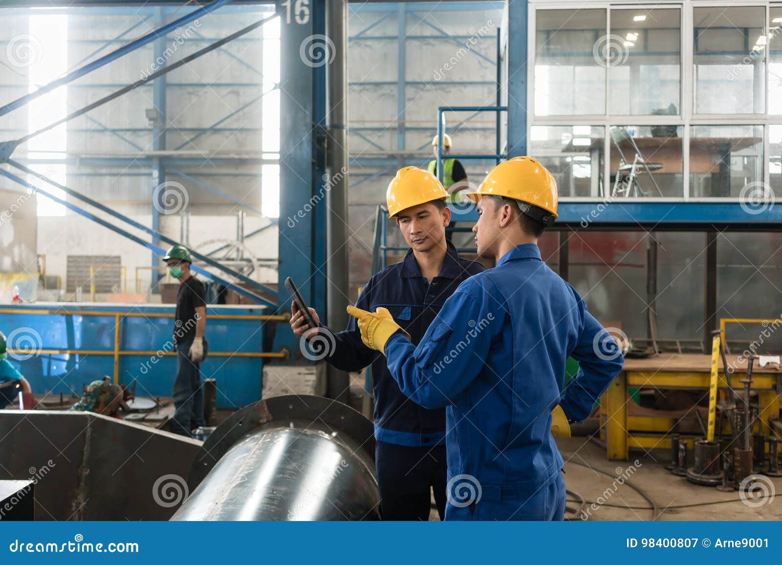 Experts Checking Information on Tablet PC in a Modern Factory Stock ...