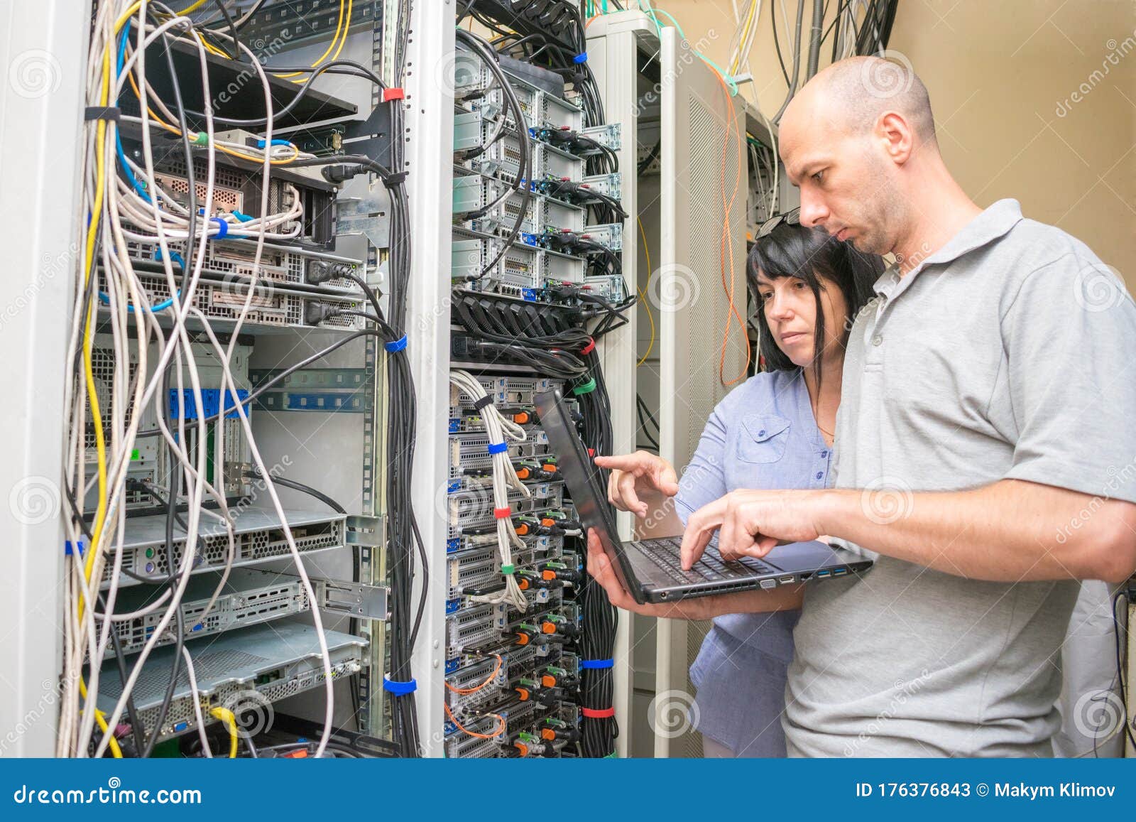 Experts Look at the Computer Screen in the Data Center. System ...