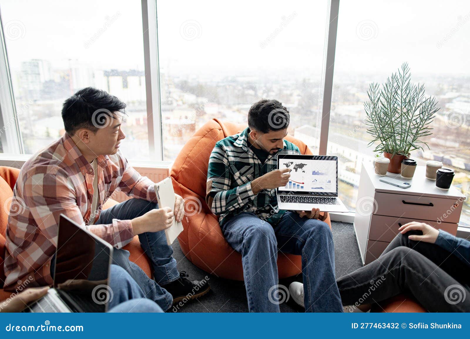 Experts Talking about Data on Computer in Office Interior Stock Photo ...
