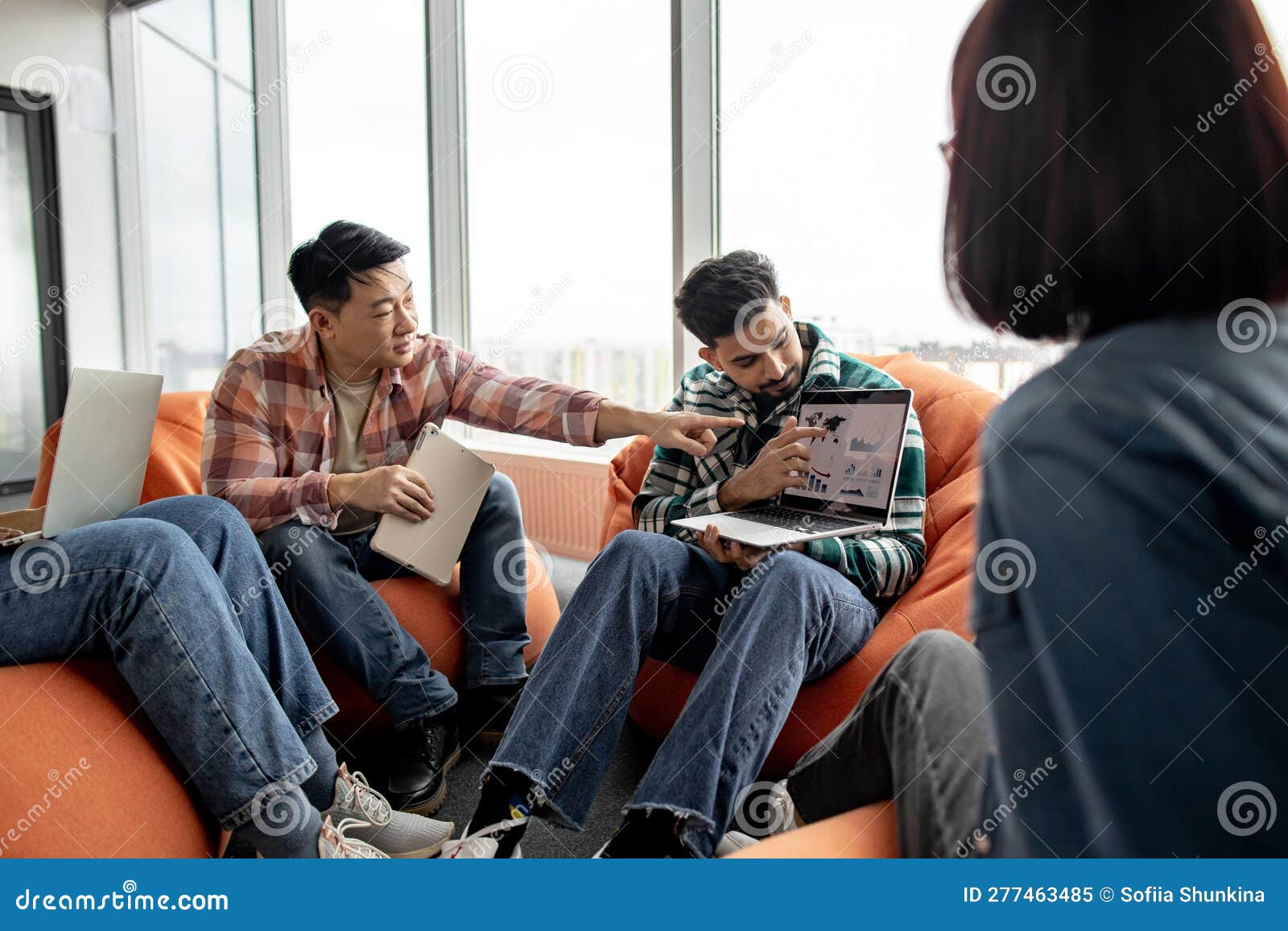 Experts Talking about Data on Computer in Office Interior Stock Image ...