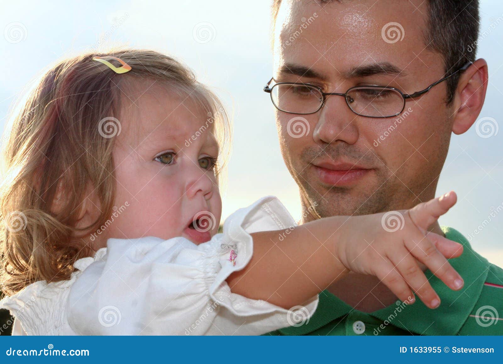 Explaining it All To Dad stock image. Image of attention - 1633955