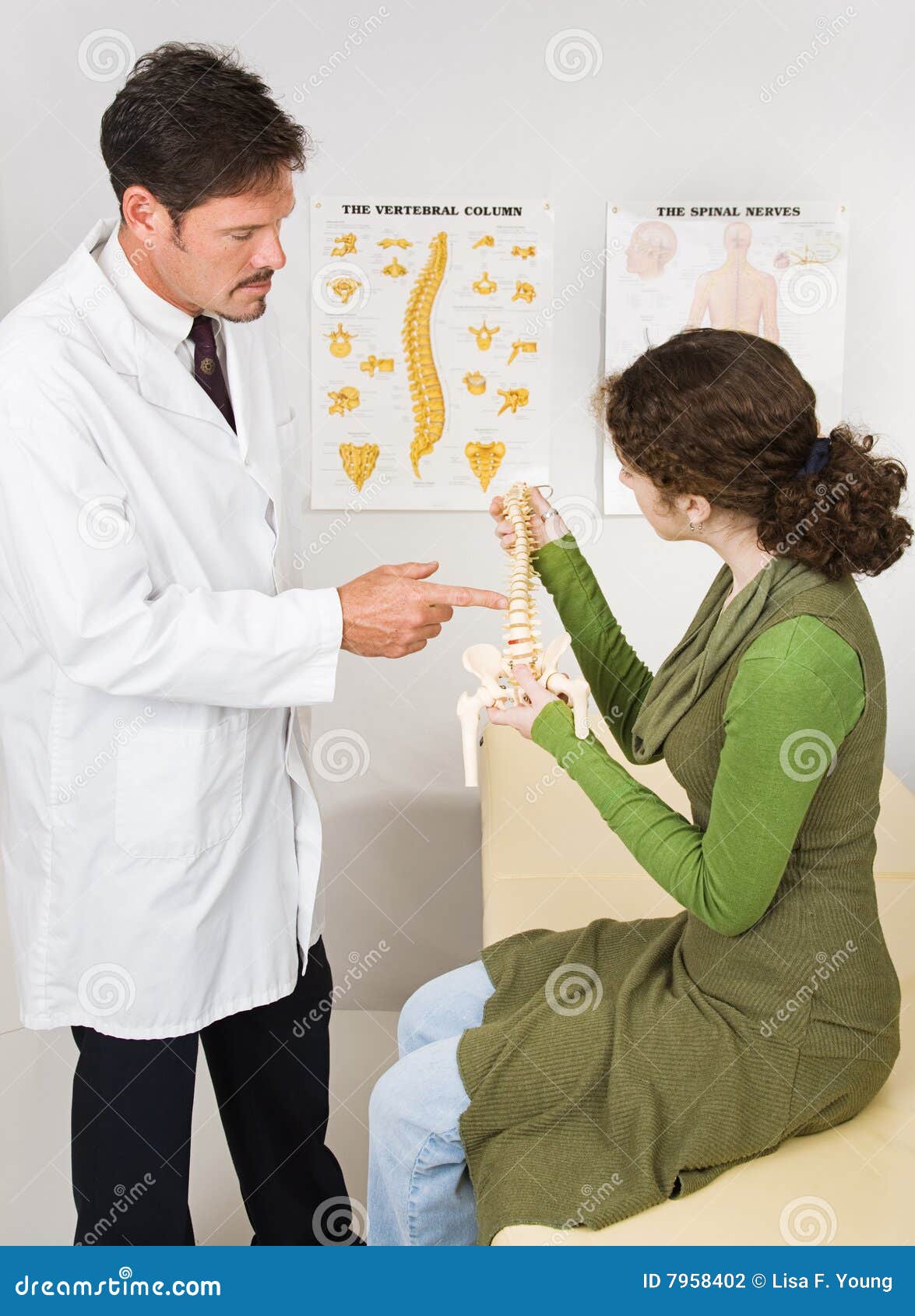 Explaining Chiropractic Treatment Stock Photo - Image of female ...