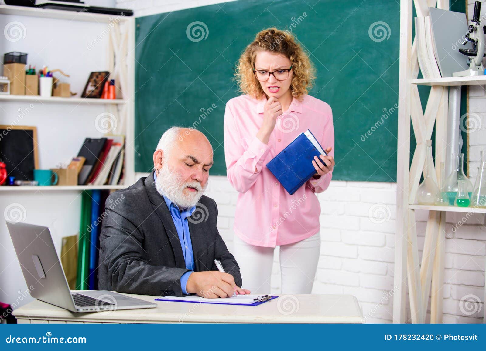 Check Homework. Teacher Formal Wear And Glasses Looks Smart, Chalkboard ...